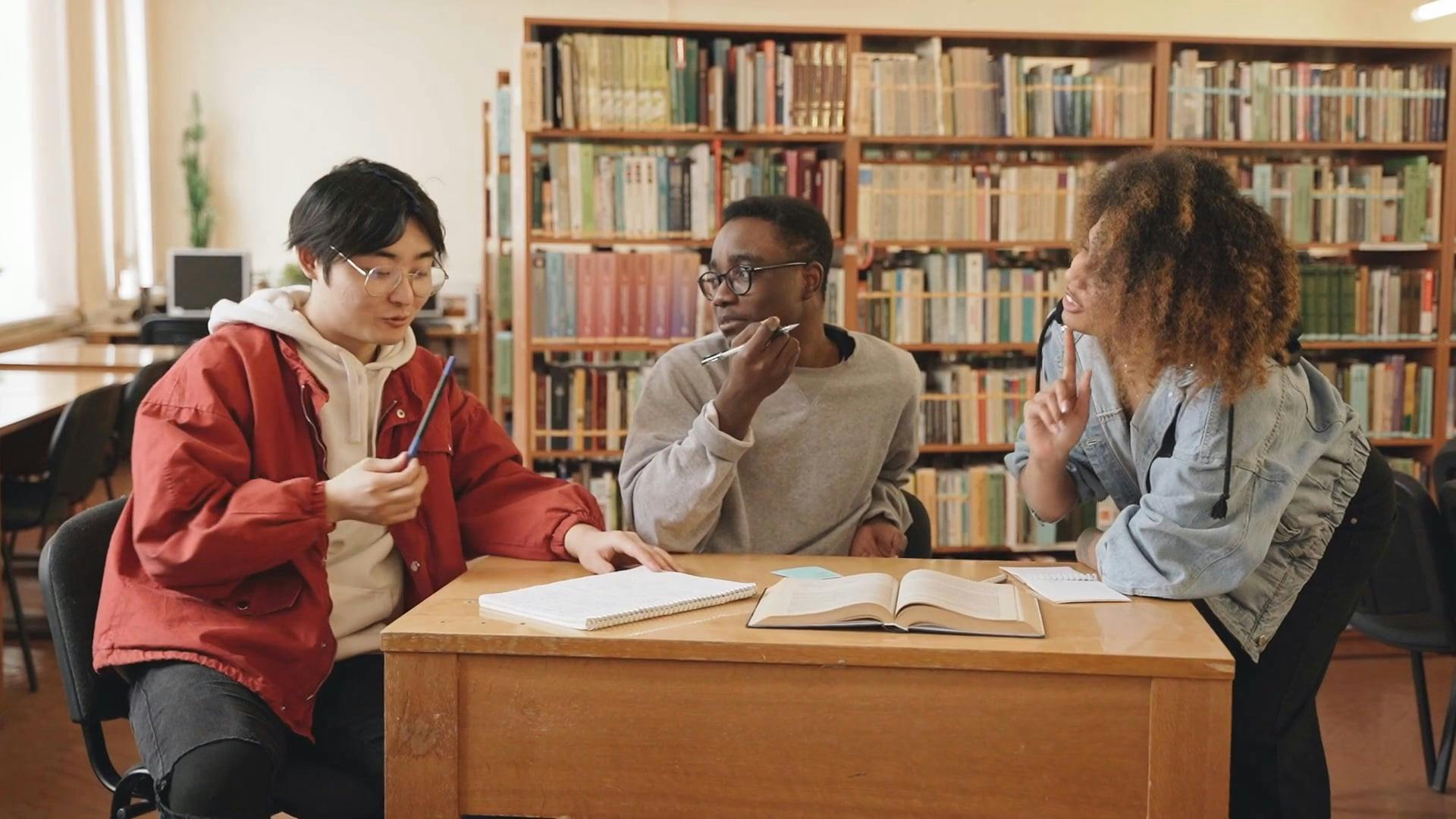 People Reading a Book in the Library Free Stock Video Footage, Royalty ...