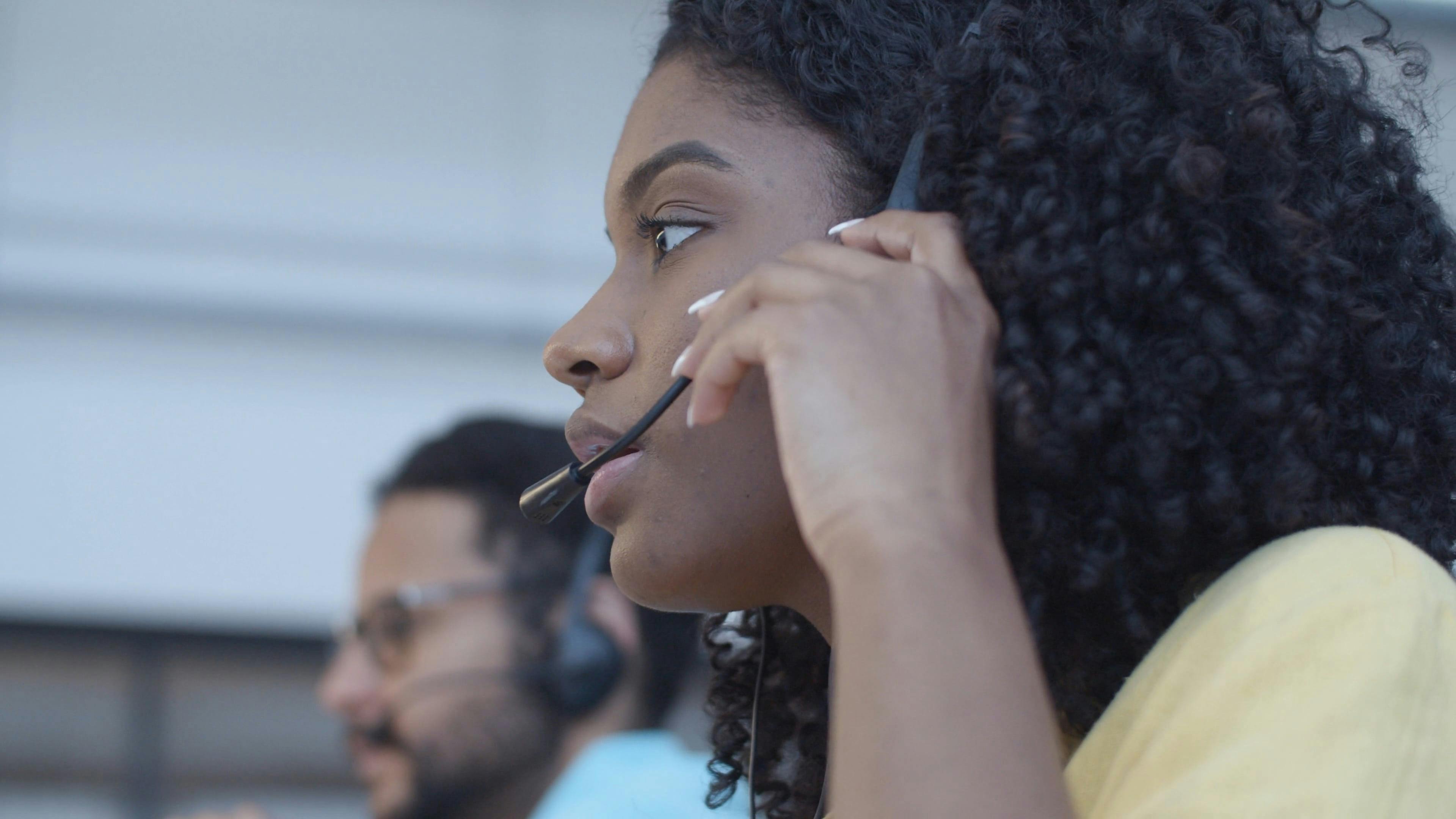 A Woman Talking on a Headset · Free Stock Video