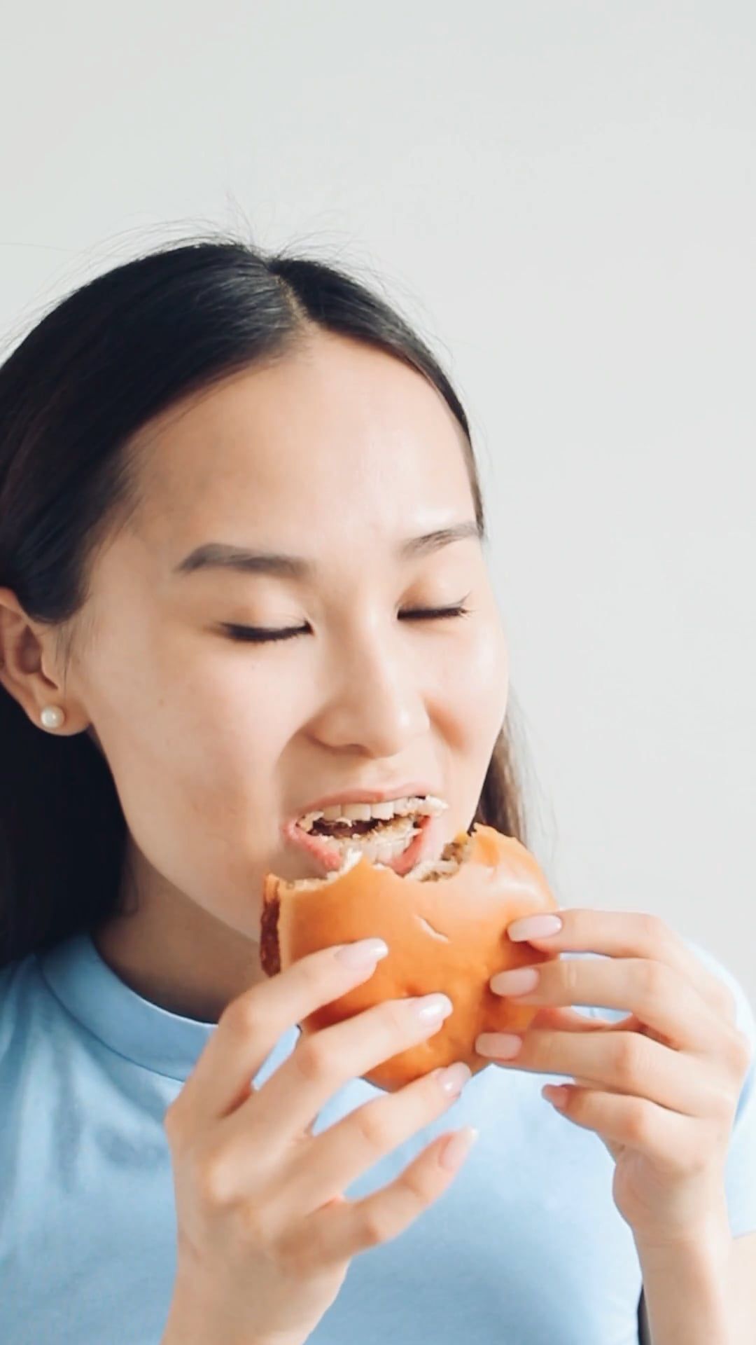 Woman Eating a Burger · Free Stock Video