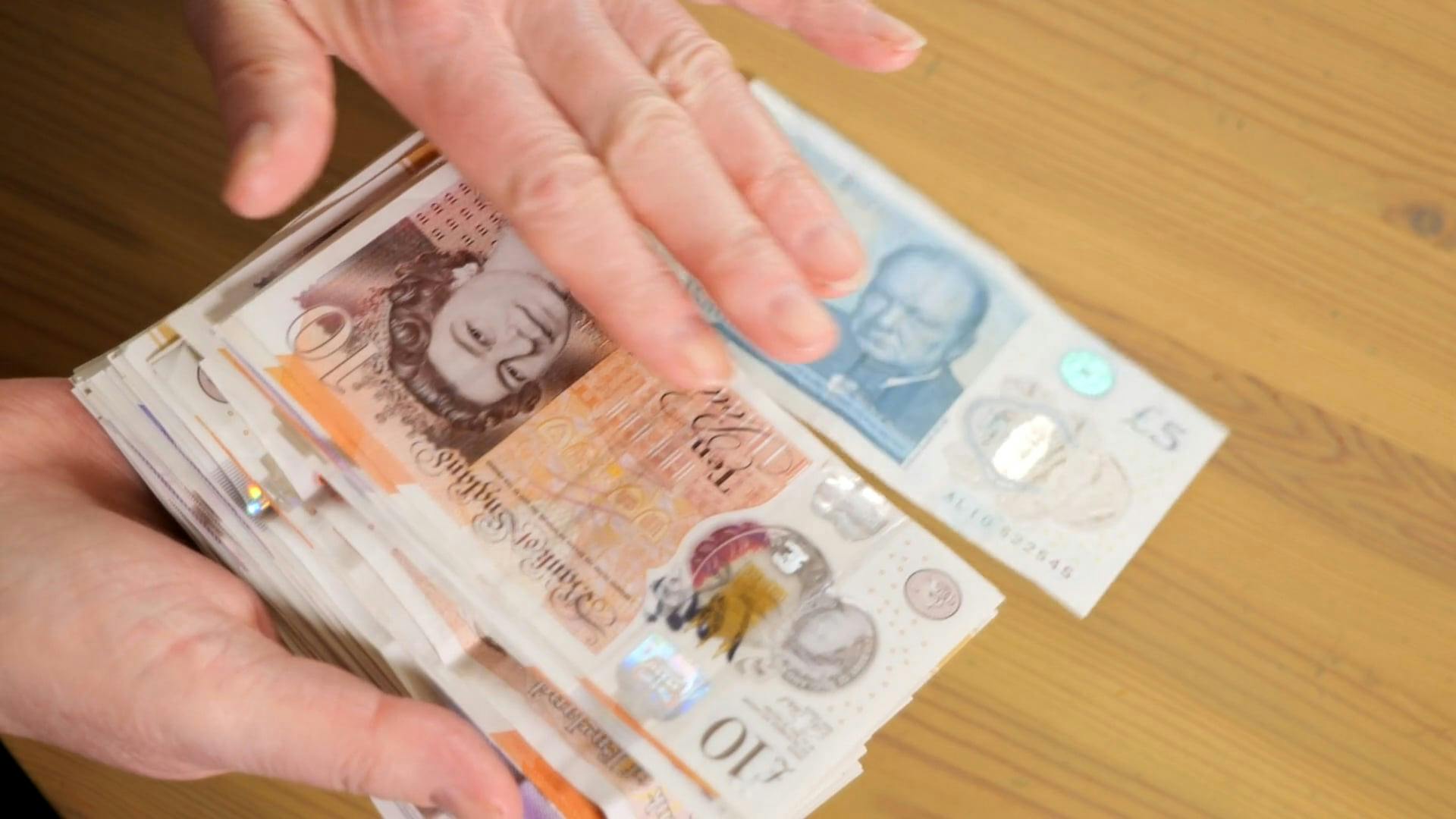 Cash Falling on a Table · Free Stock Video