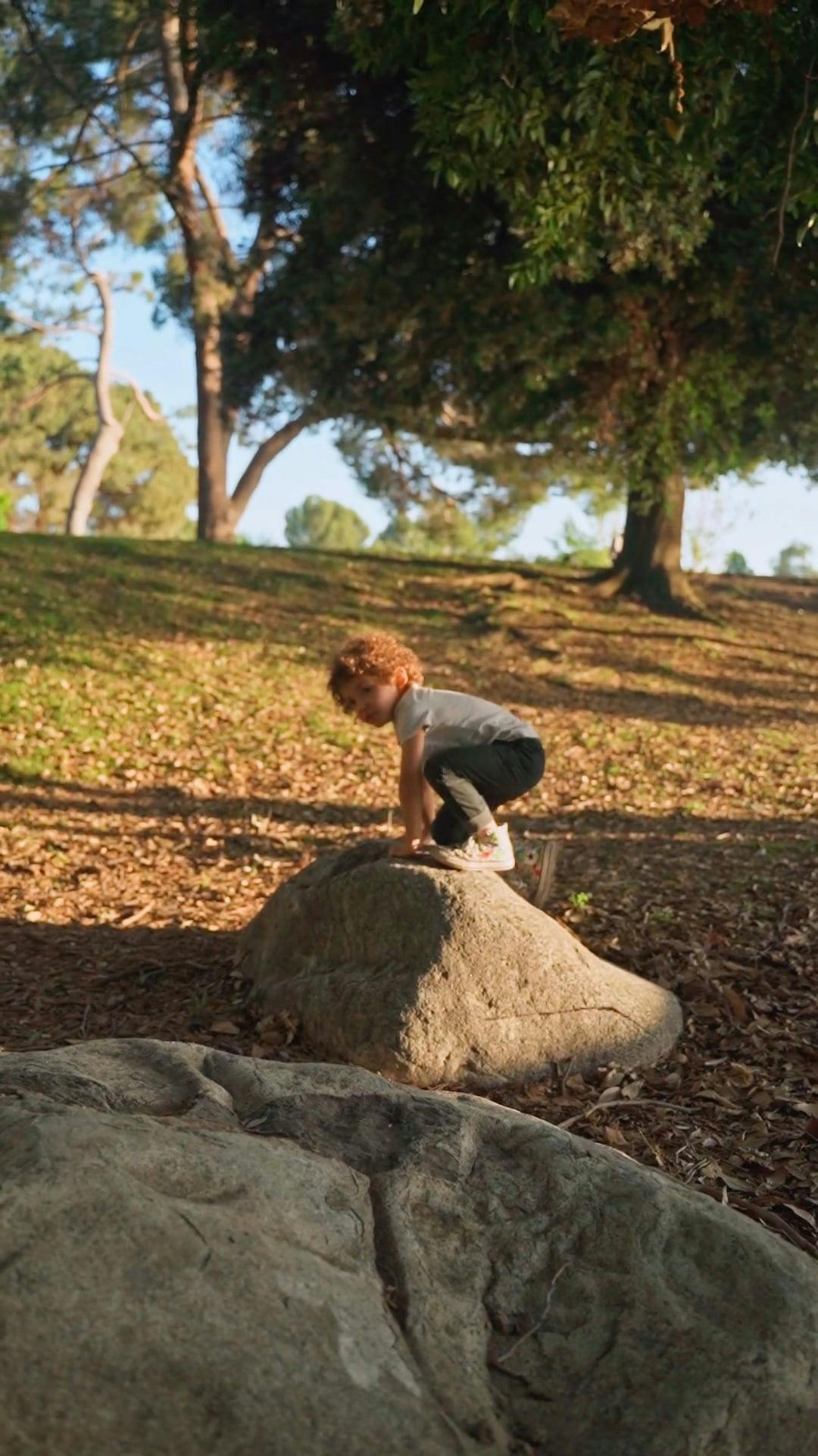 Child Jumping on Rocks · Free Stock Video