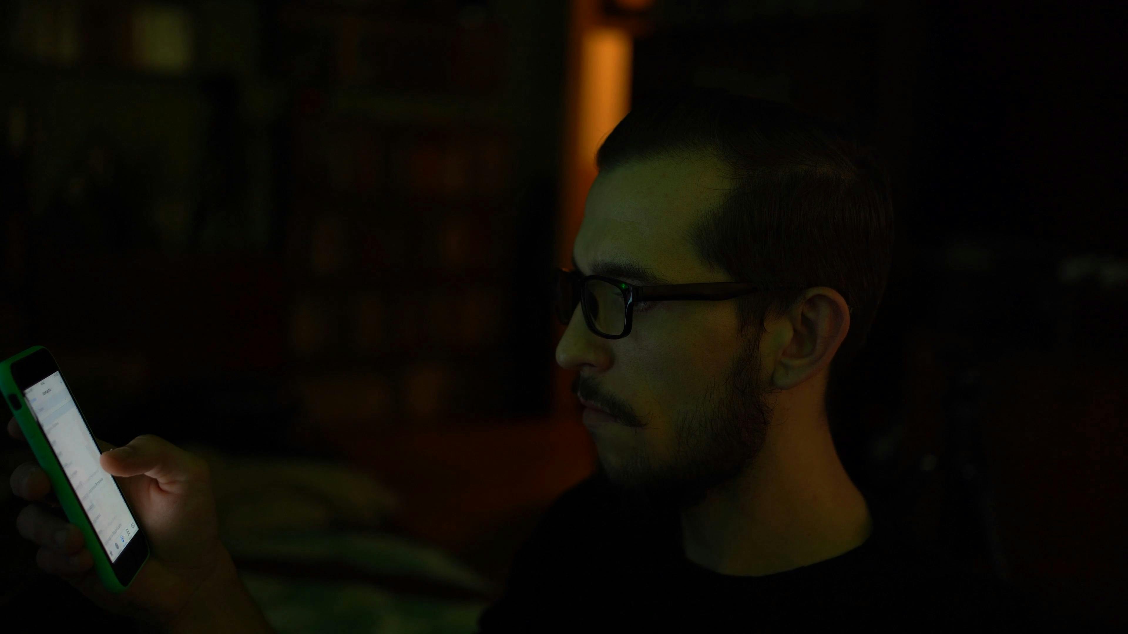 A Man Scrolling on His Phone Free Stock Video Footage, Royalty-Free 4K ...