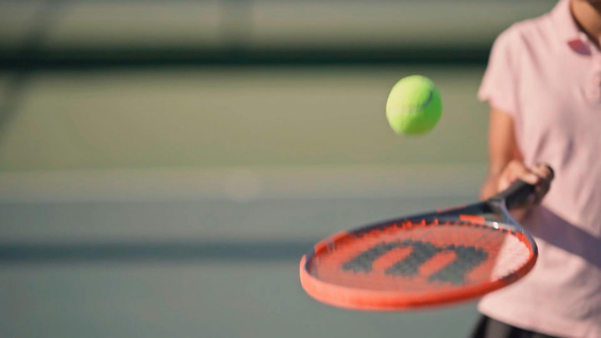 A Girl Bouncing A Tennis Ball Off Her Racket · Free Stock Video