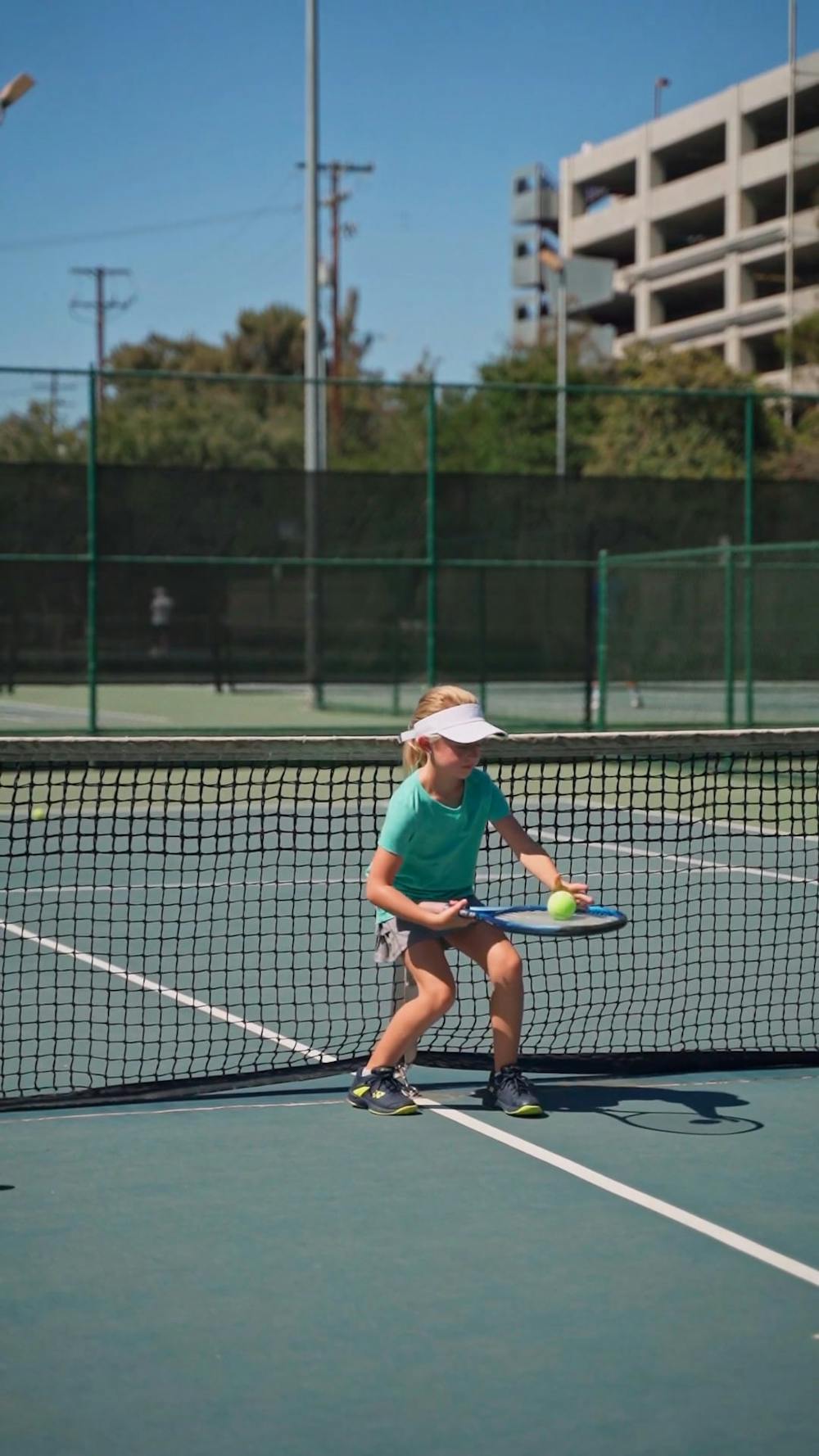 A Girl Bouncing A Tennis Ball With Her Racket · Free Stock Video