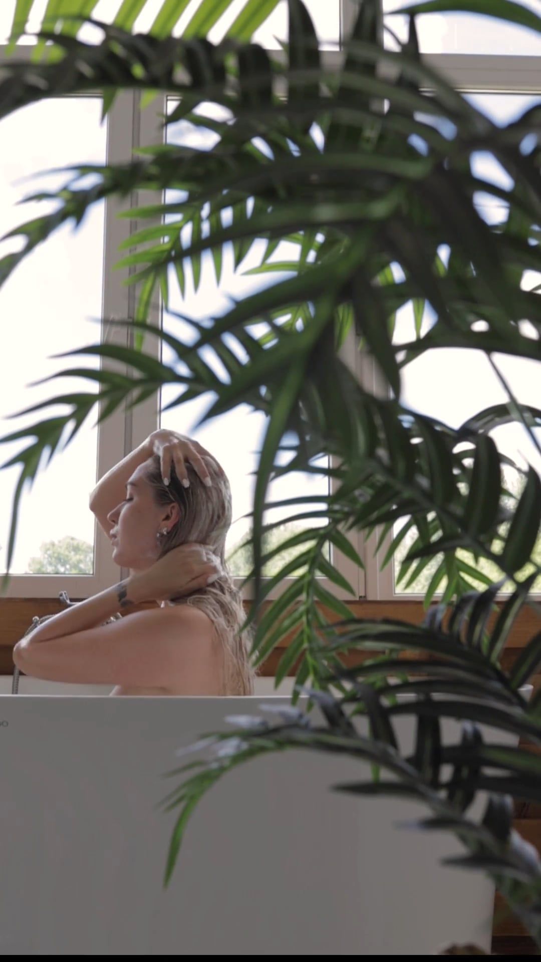 A Woman Shampooing Her Hair while in a Bathtub Free Stock Video Footage ...