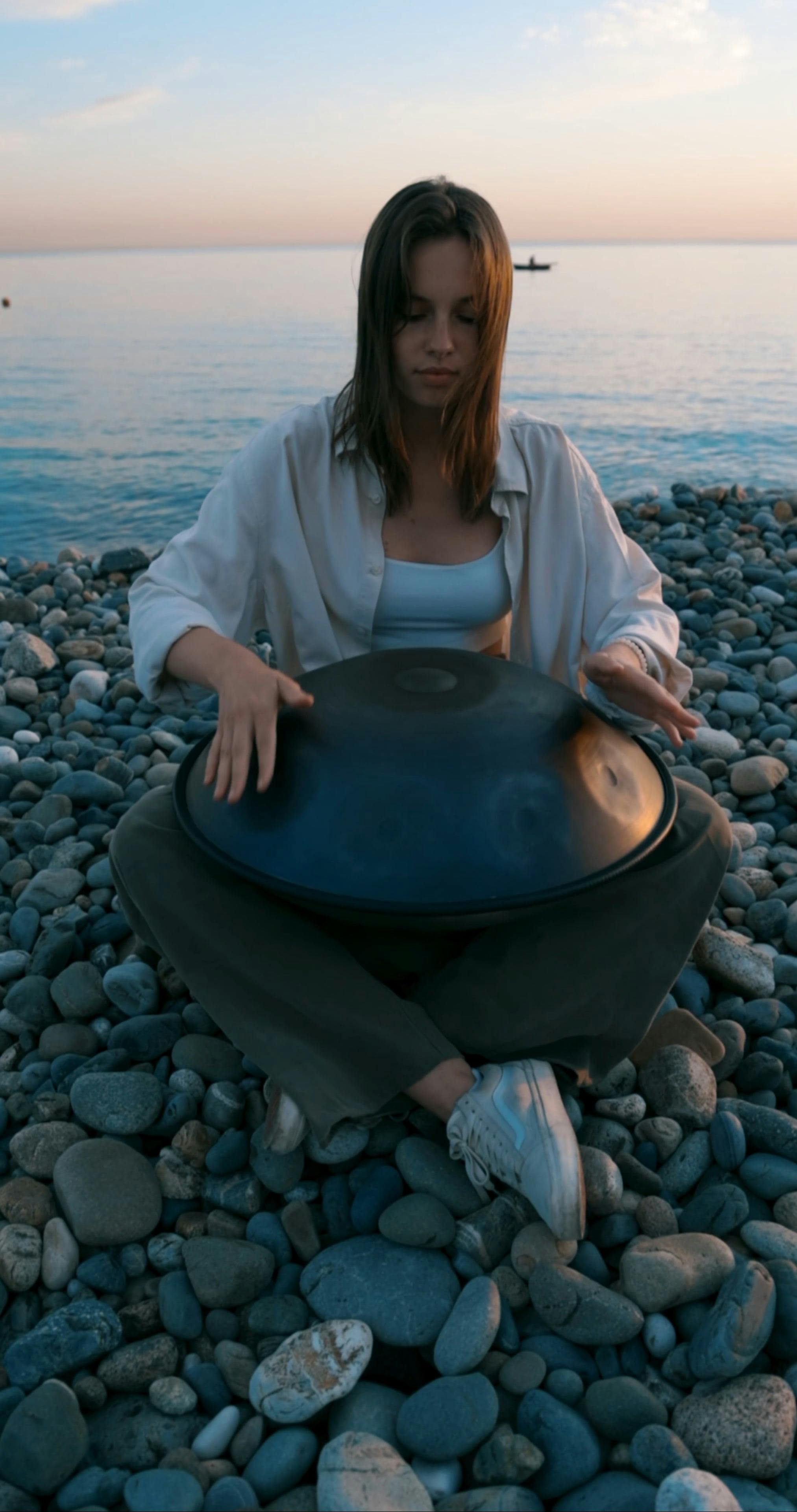 Woman Playing Hang Drum Free Stock Video Footage, Royalty-Free 4K & HD ...