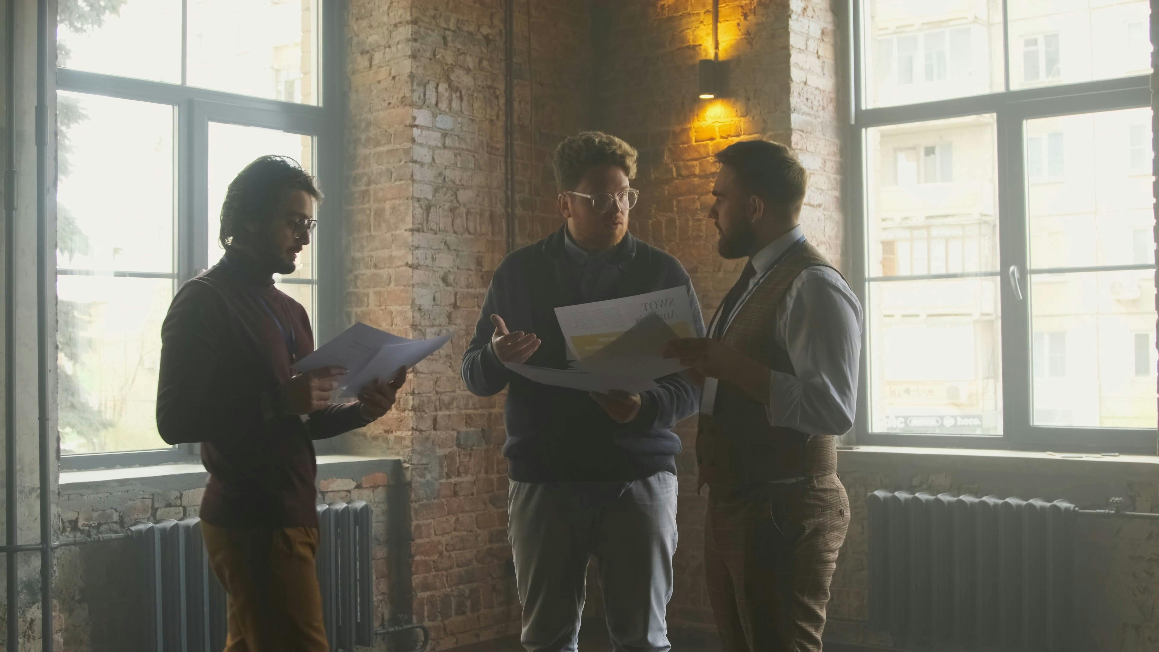 Two Colleagues Discussing Office Paperworks · Free Stock Video