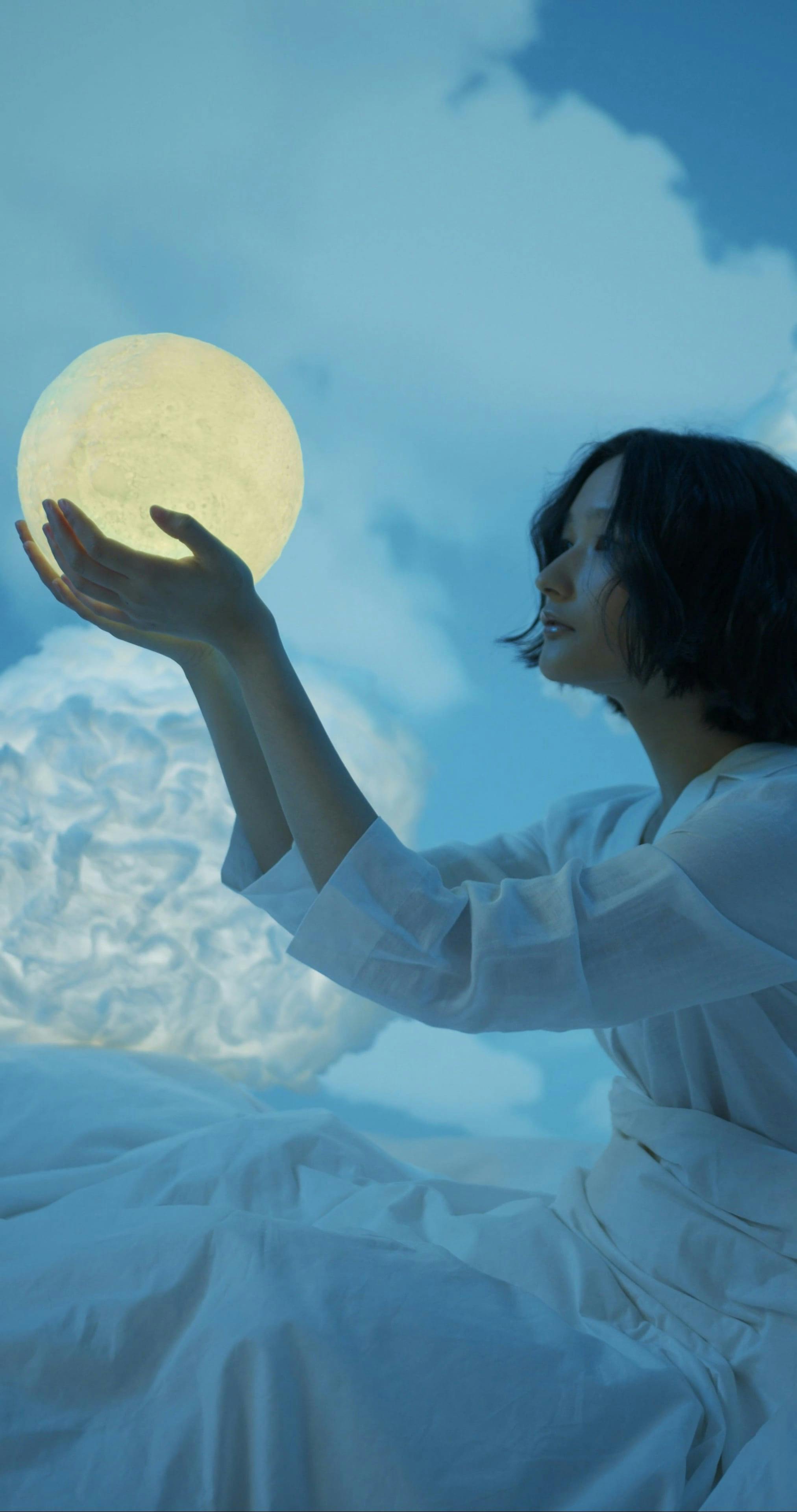 A Pretty Woman Holding a Moon · Free Stock Video