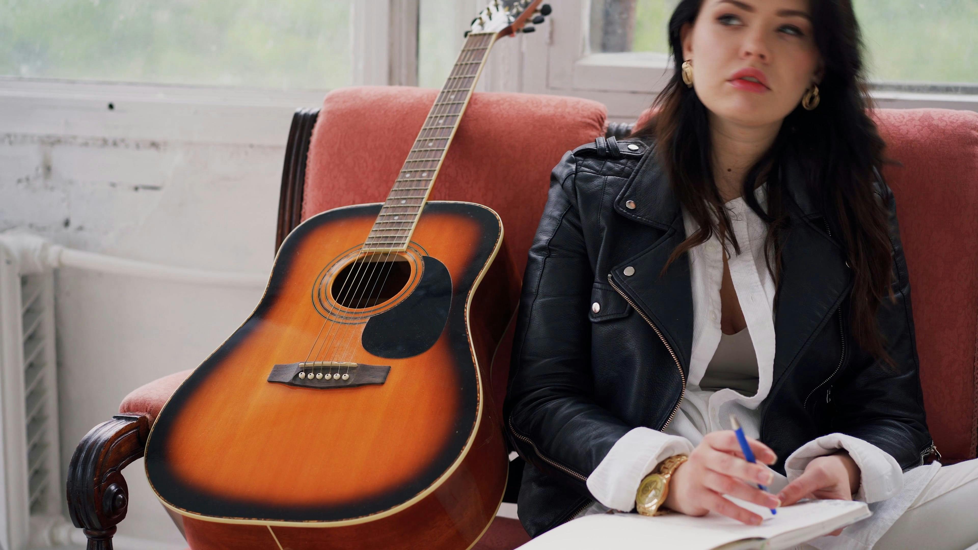 A Woman Writing a Song · Free Stock Video