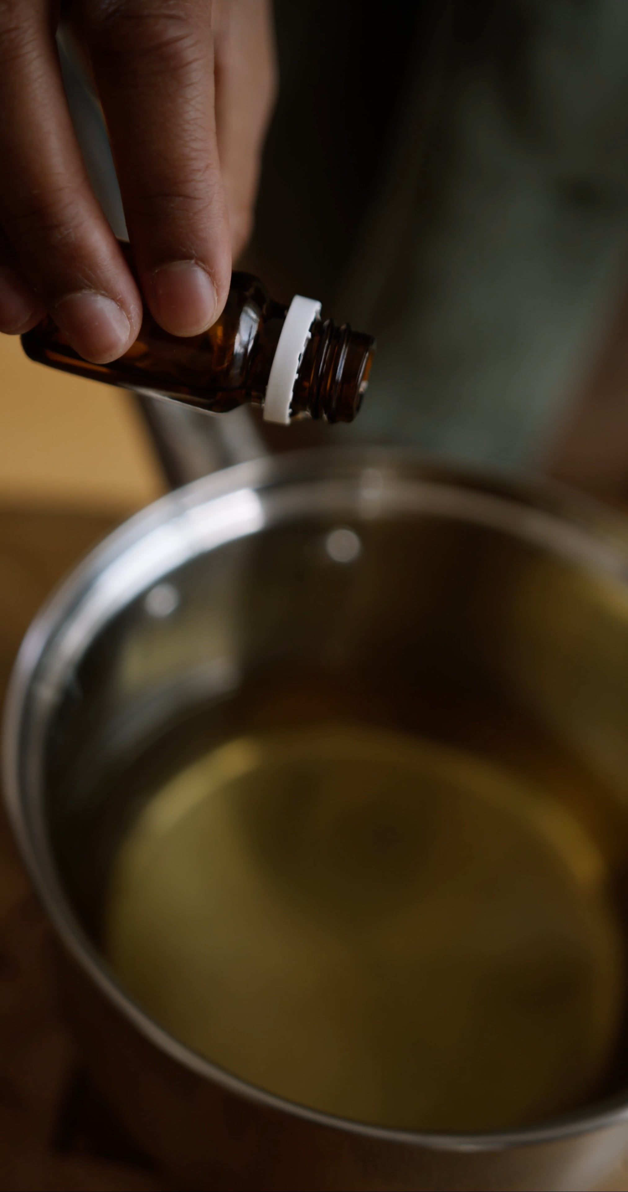 A Peron Pouring Droplets of Liquid on a Cooking Pot Free Stock Video ...