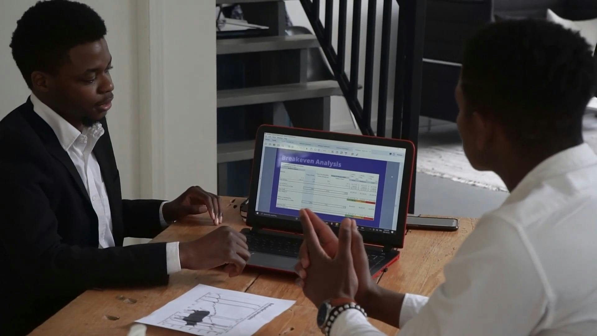 Two Men Discussing about Work while Looking at a Laptop · Free Stock Video