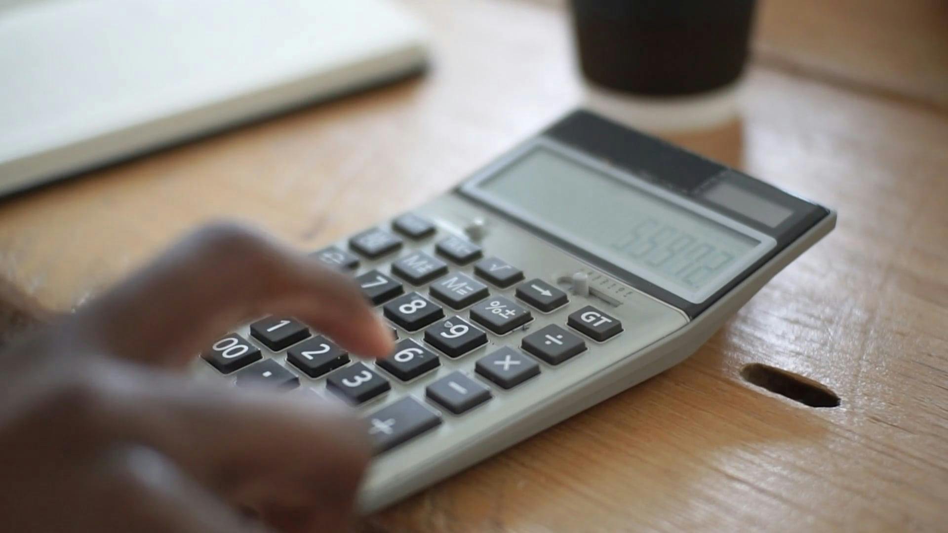 A Person Using a Calculator · Free Stock Video
