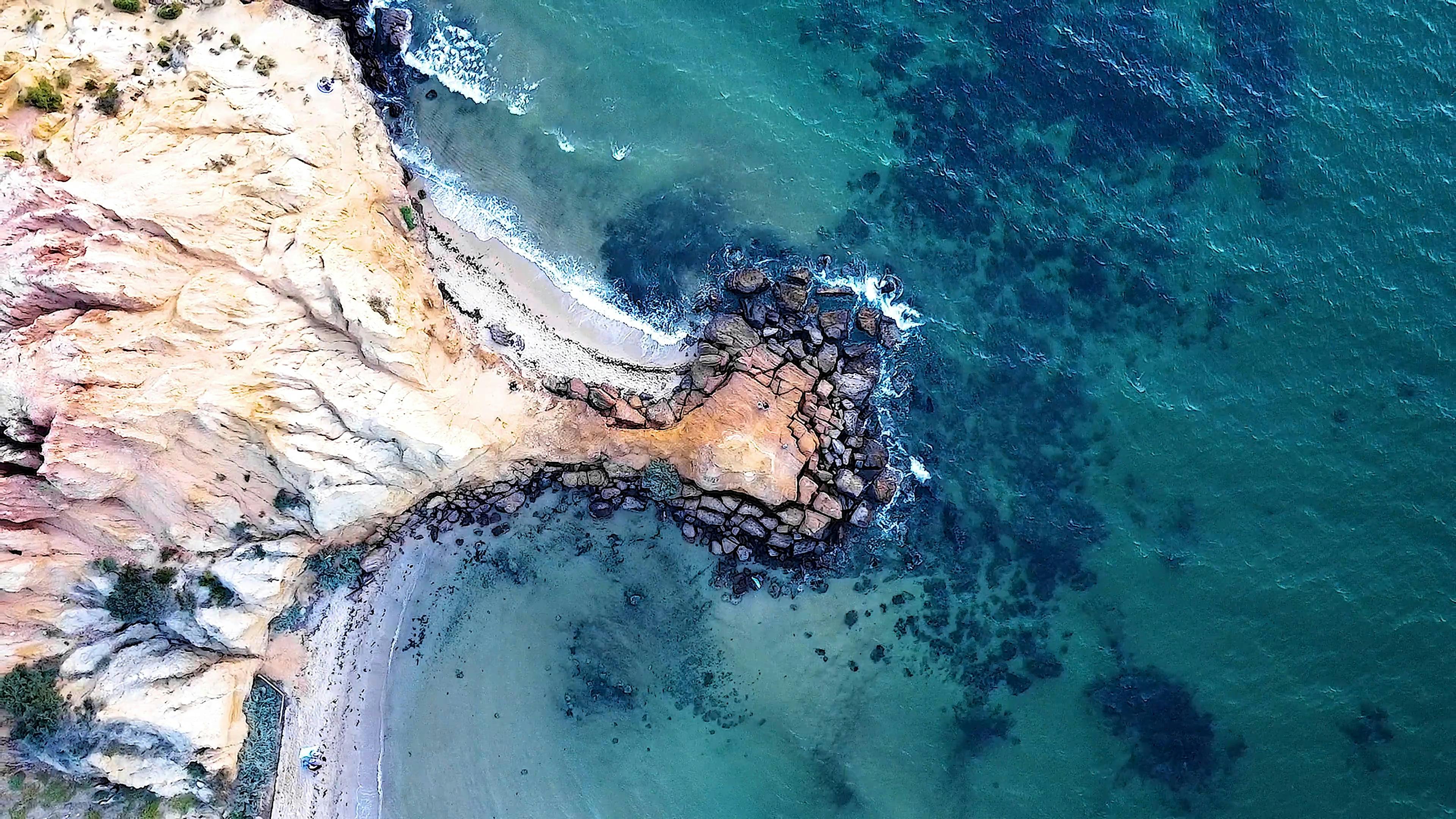 Top View of a Beach and Rocks · Free Stock Video