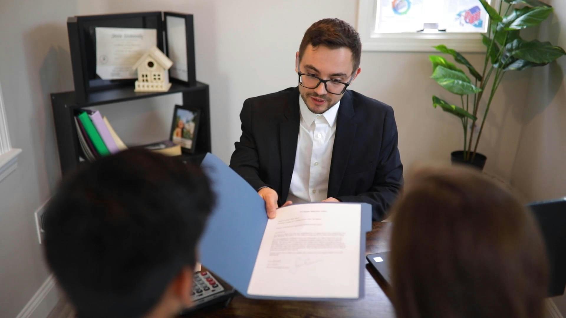 A Man Discussing a Contract to a Couple Free Stock Video Footage ...