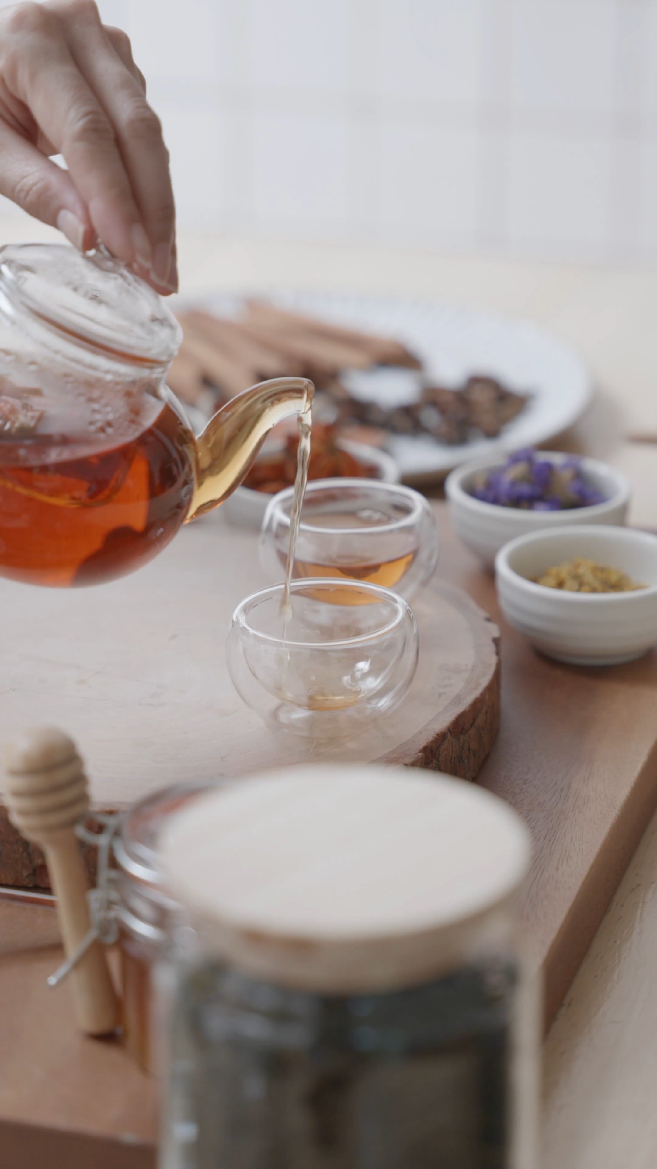 A Person Pouring a Hot Tea in a Mini Bowls · Free Stock Video