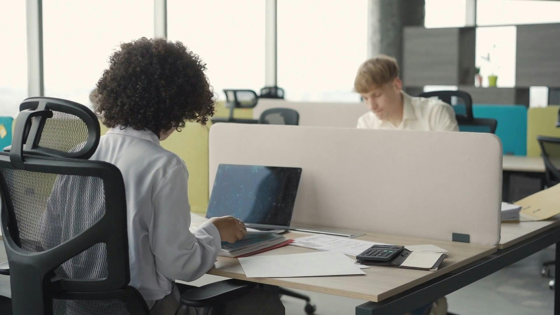 A Man and a Woman Sitting While Arranging Things on the Table · Free ...