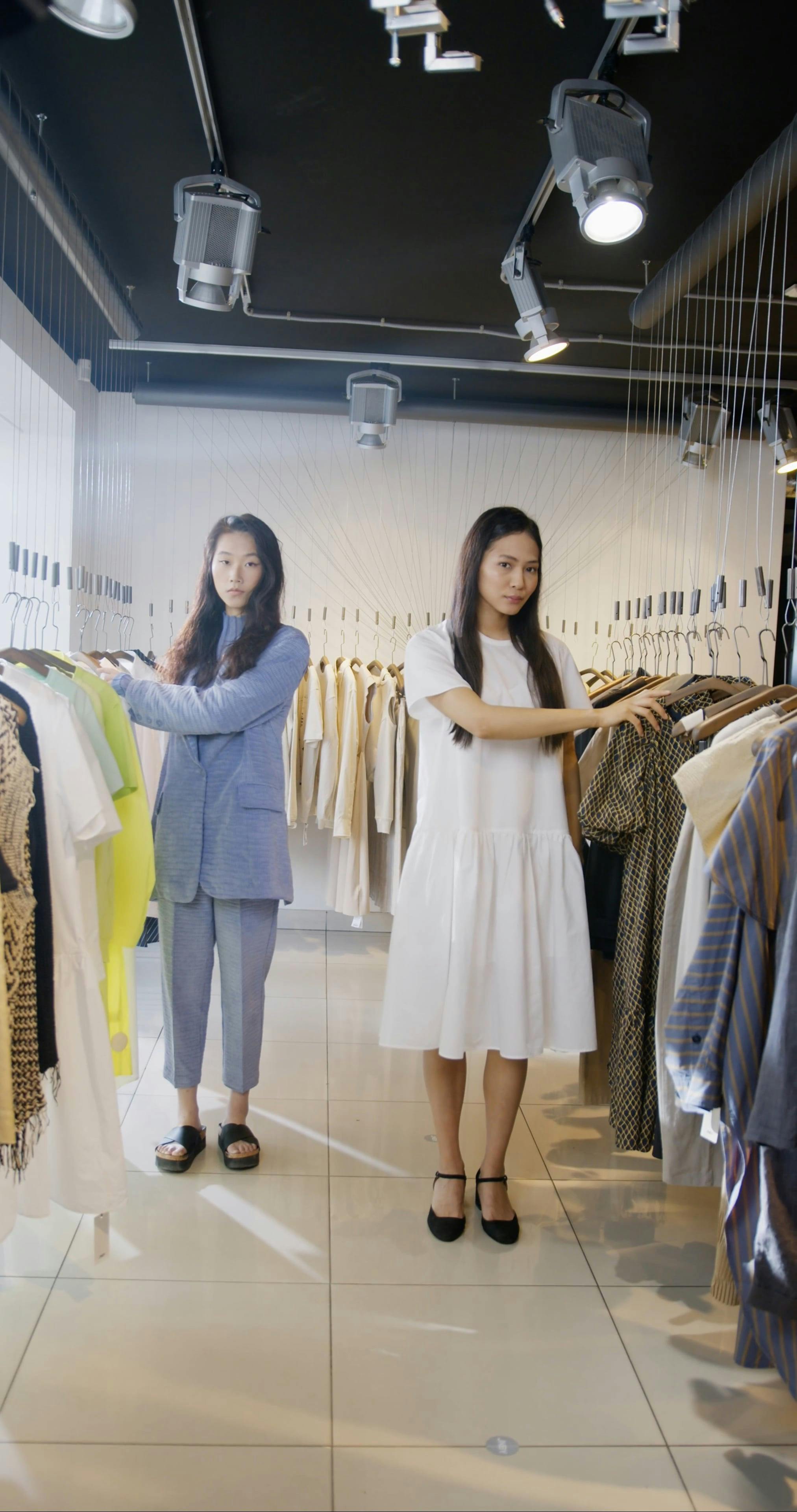 A Woman Choosing Clothes Fro A Wardrobe Rack Backstage Free Stock Video ...