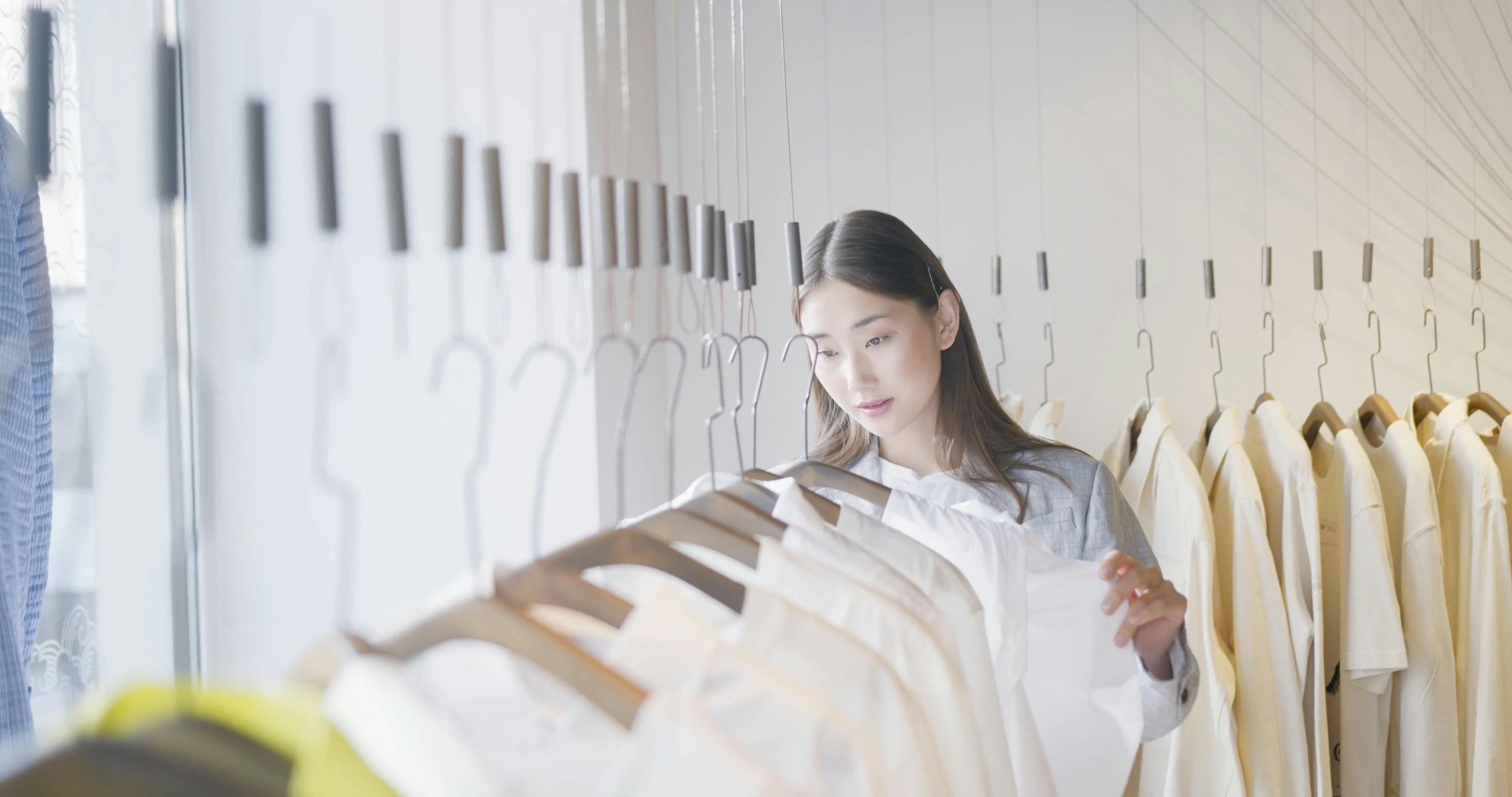 A Person Touching Clothes in a Shop Free Stock Video Footage, Royalty ...