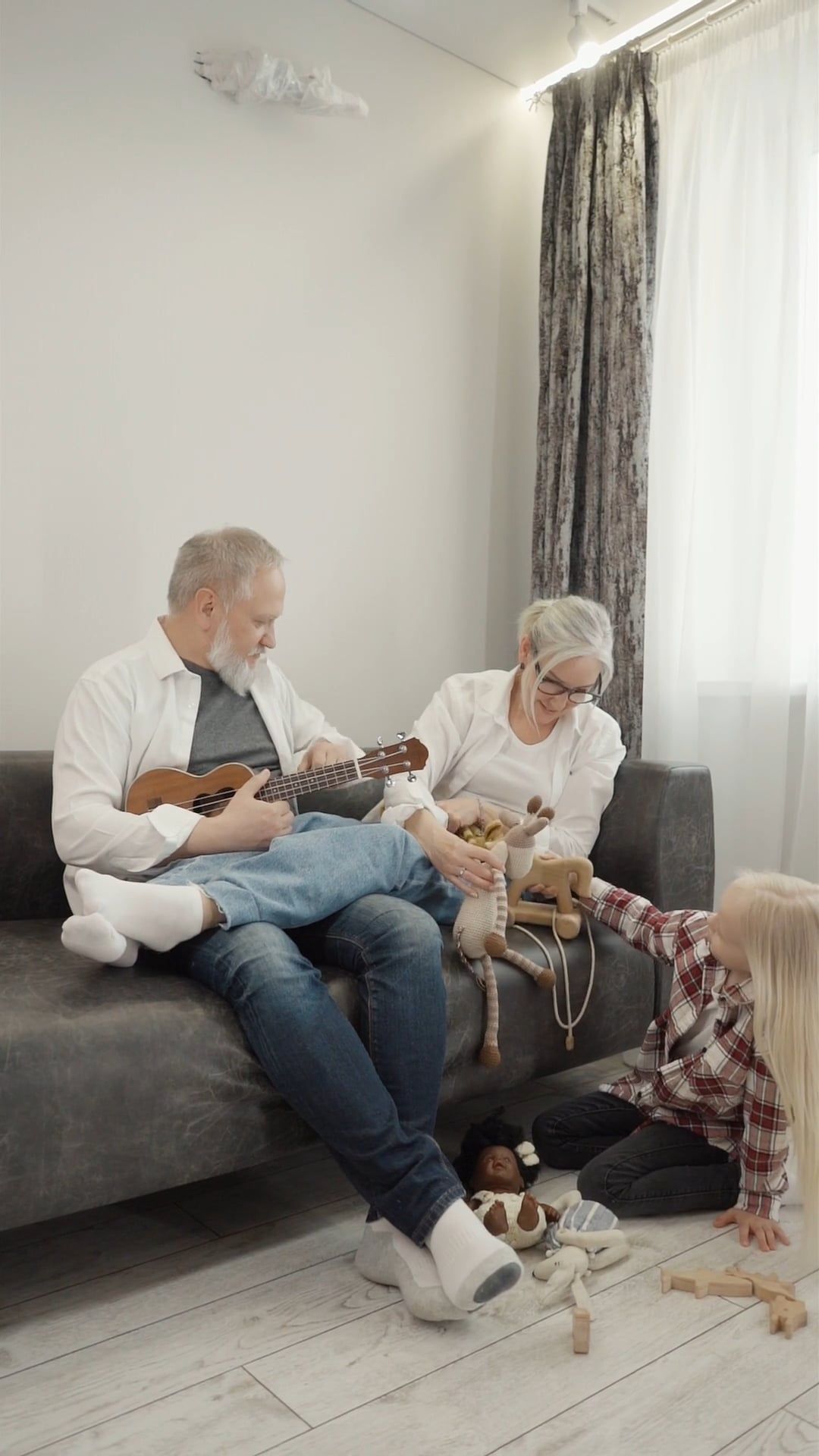 A Girl Playing Stuff Toys Together with her Grandparents Free Stock ...