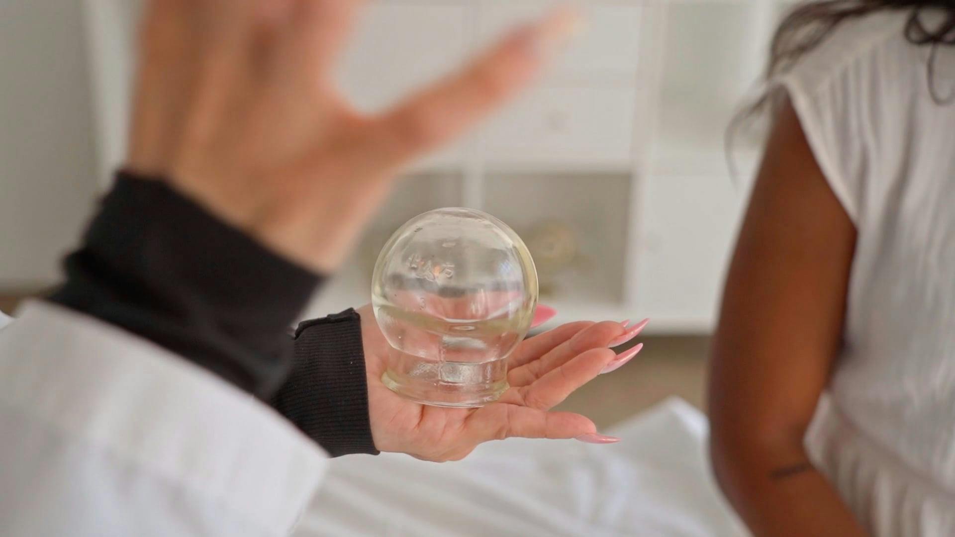 A Woman Showing and Talking About the Ventosa Cup to a Patient · Free ...