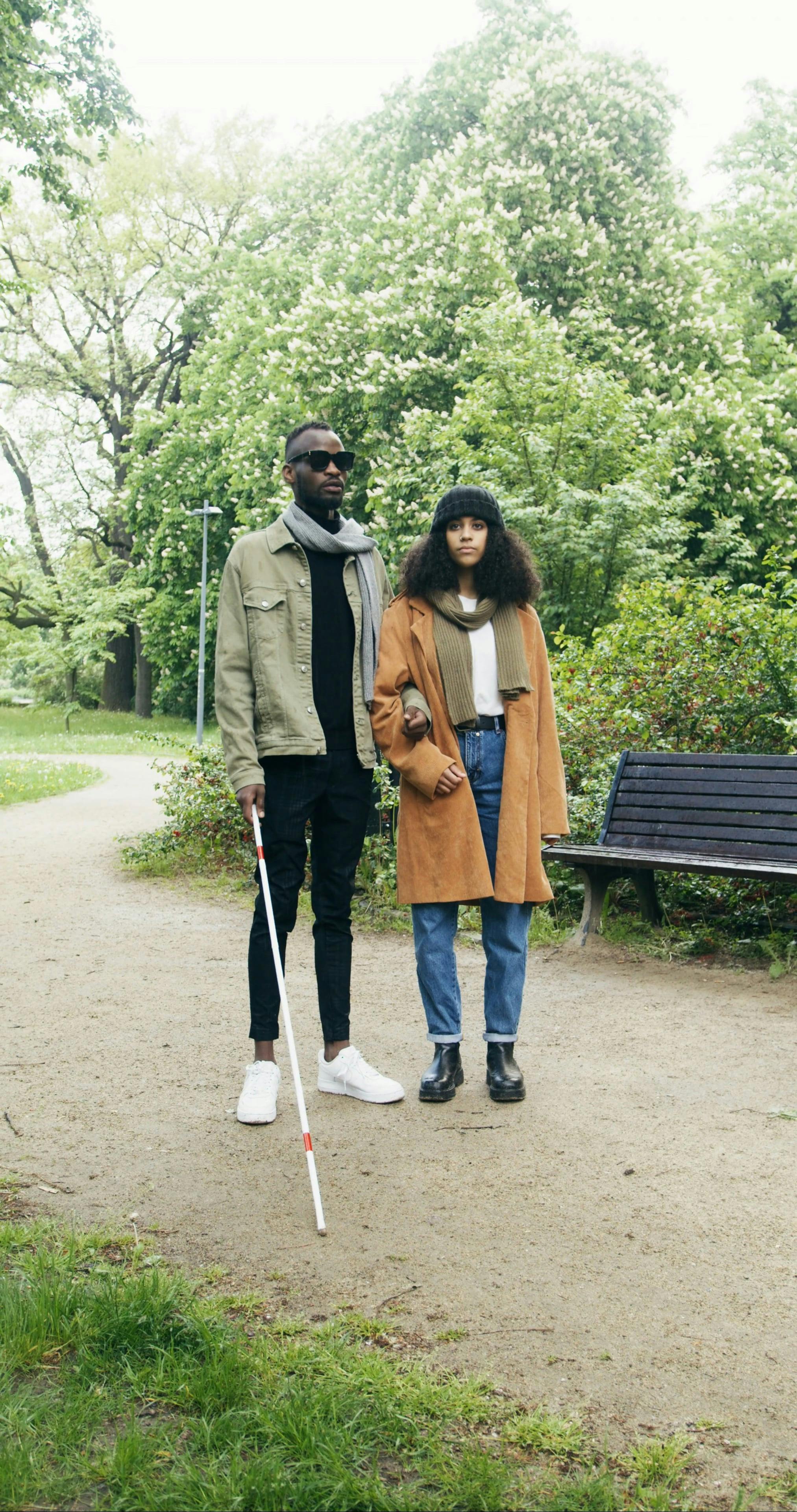 Blind Man Standing Beside a Young Woman · Free Stock Video