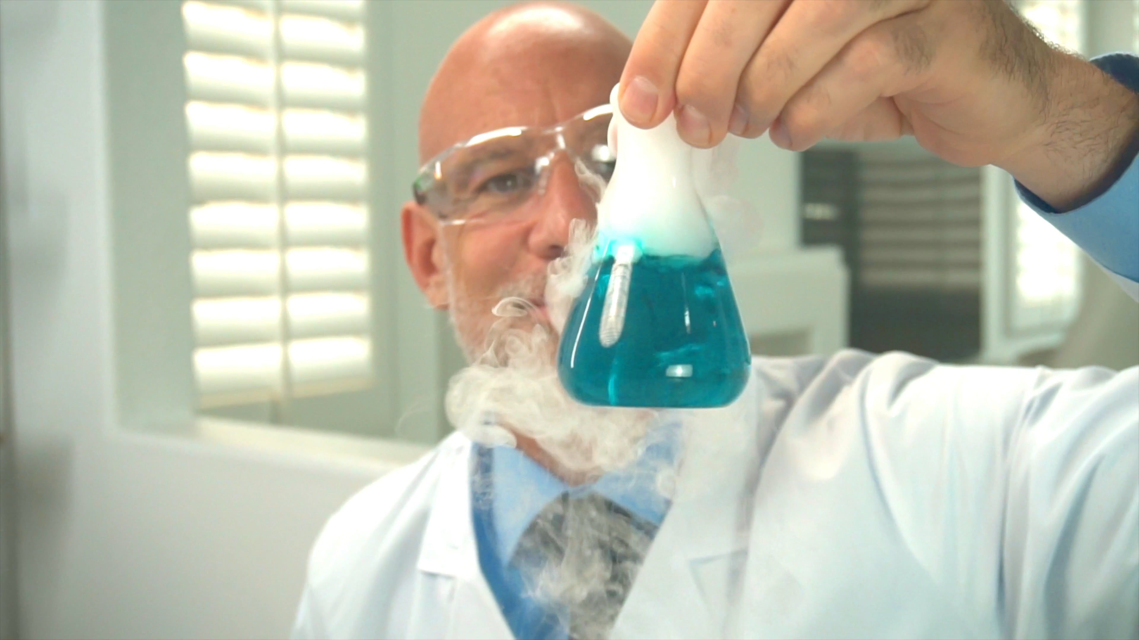 A Scientist Observing an Experiment · Free Stock Video