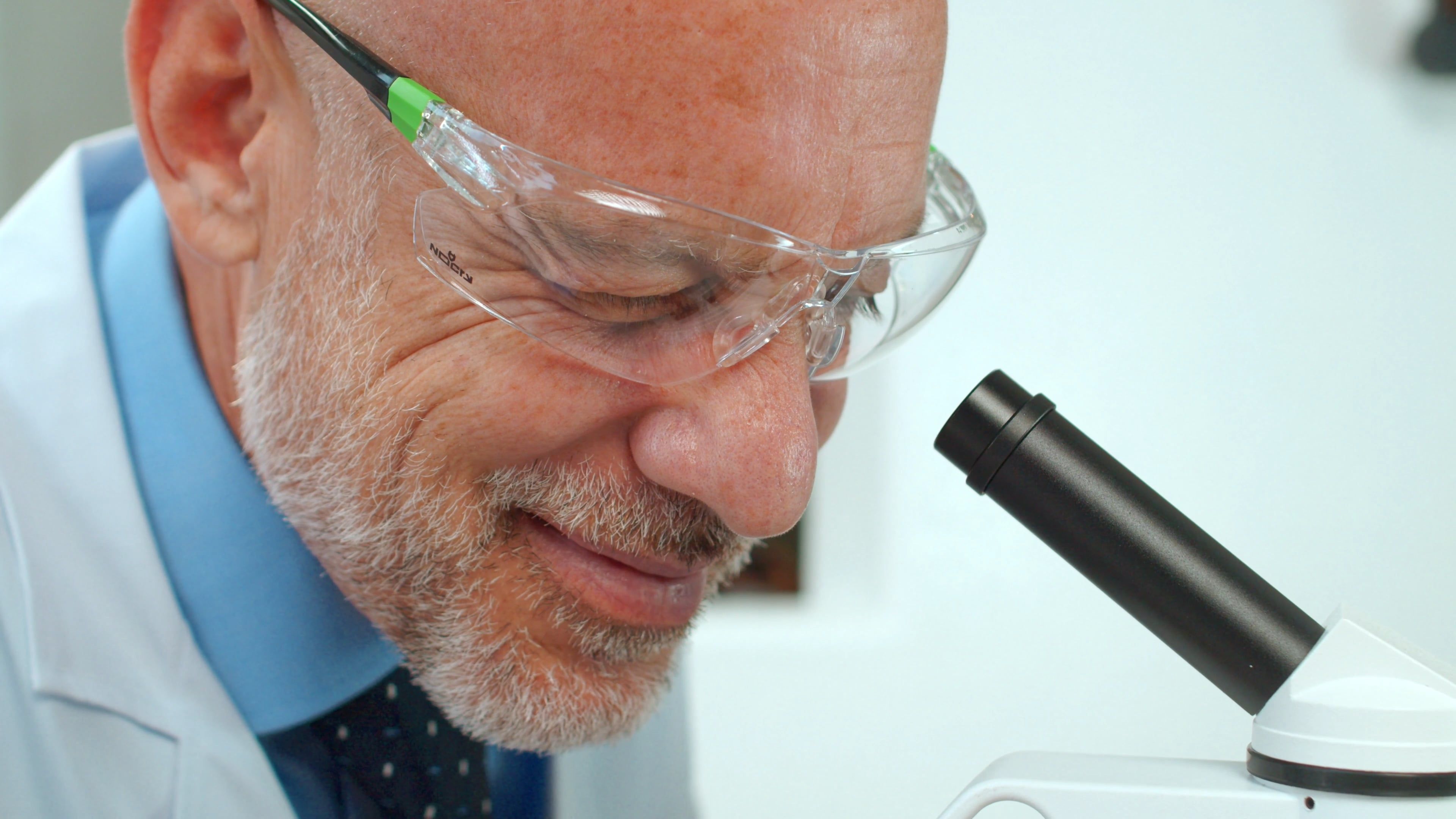 A Scientist Looking Into A Microscope Free Stock Video Footage, Royalty ...