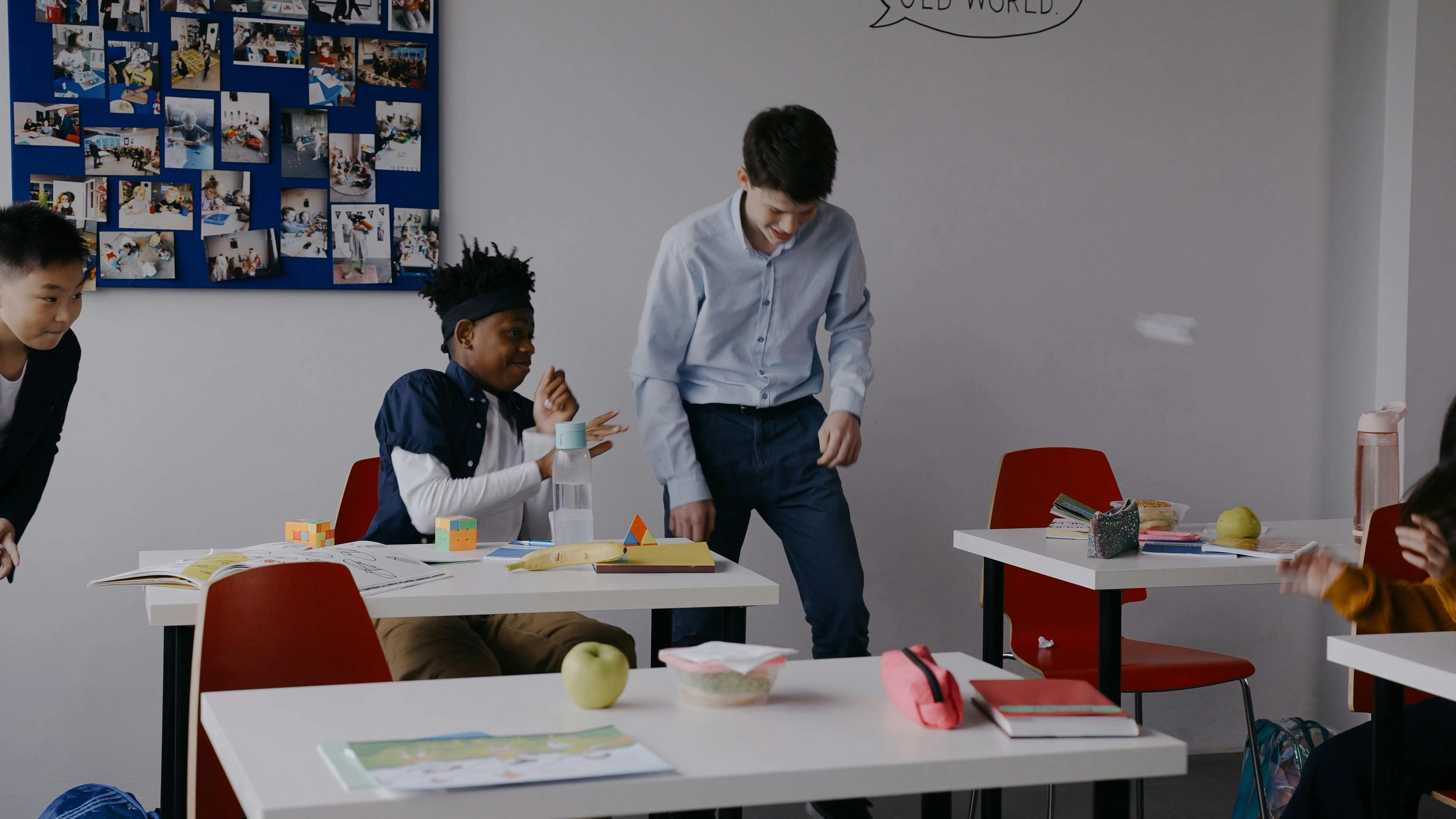 Students Throwing Crumpled Papers at Each Other · Free Stock Video