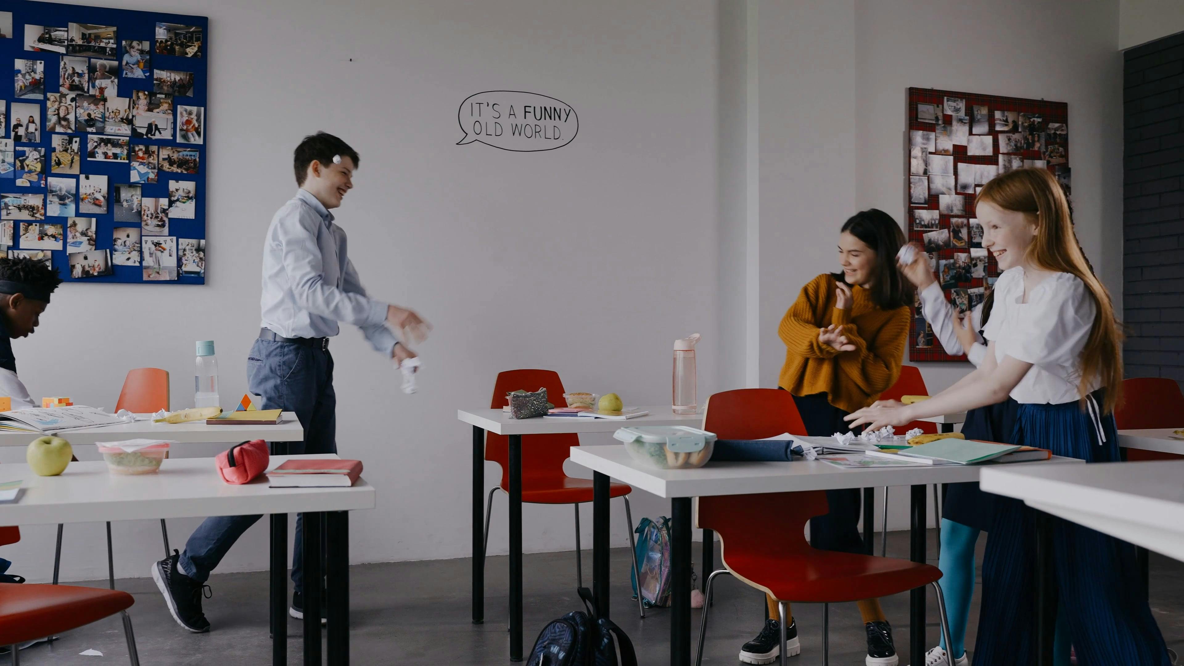 Playful Students Throwing Crumpled Papers at Each Other · Free Stock Video