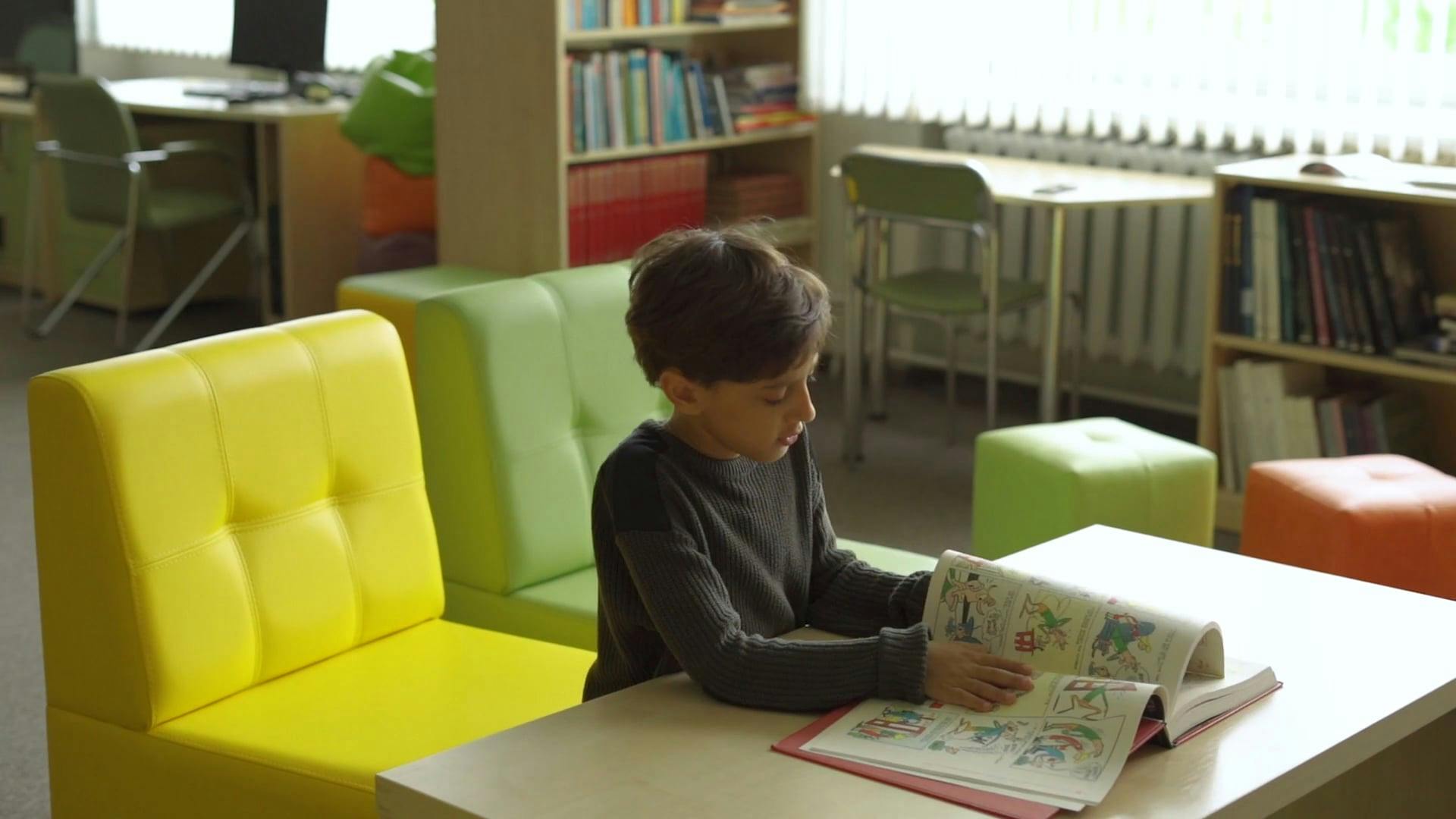 A Boy Closing a Book and Taking a Nap at School Free Stock Video ...
