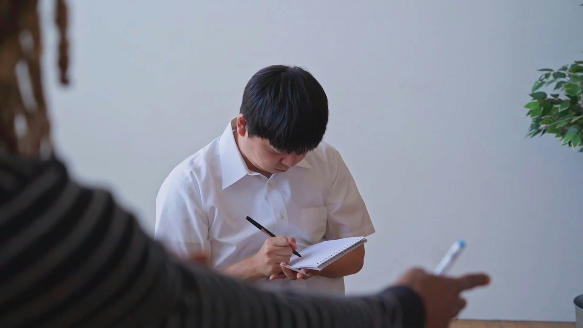 Man Listening and Taking Notes on a Notepad Free Stock Video Footage ...