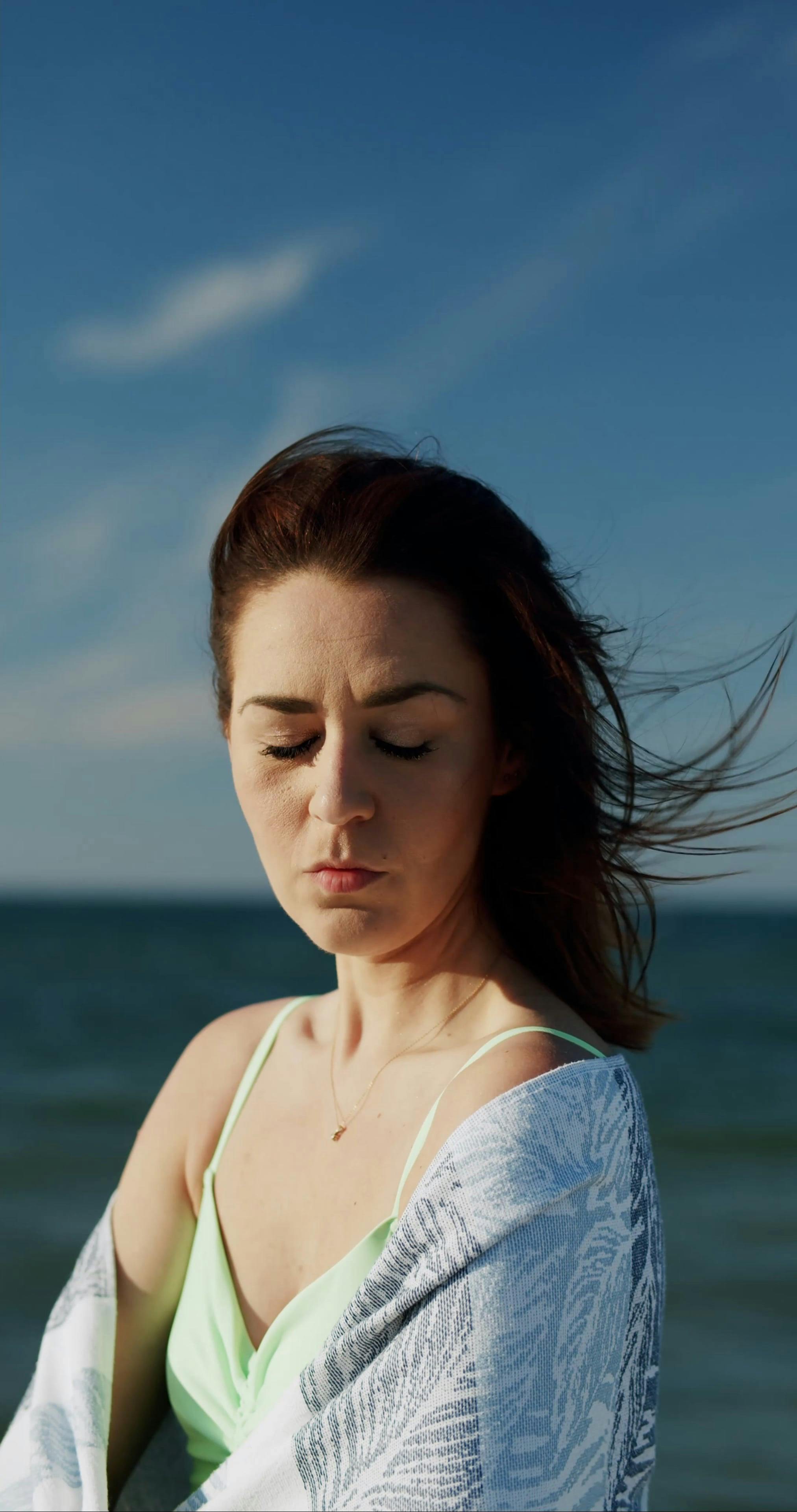 Drone shot of woman sunbathing on beach Free Stock Video Footage ...