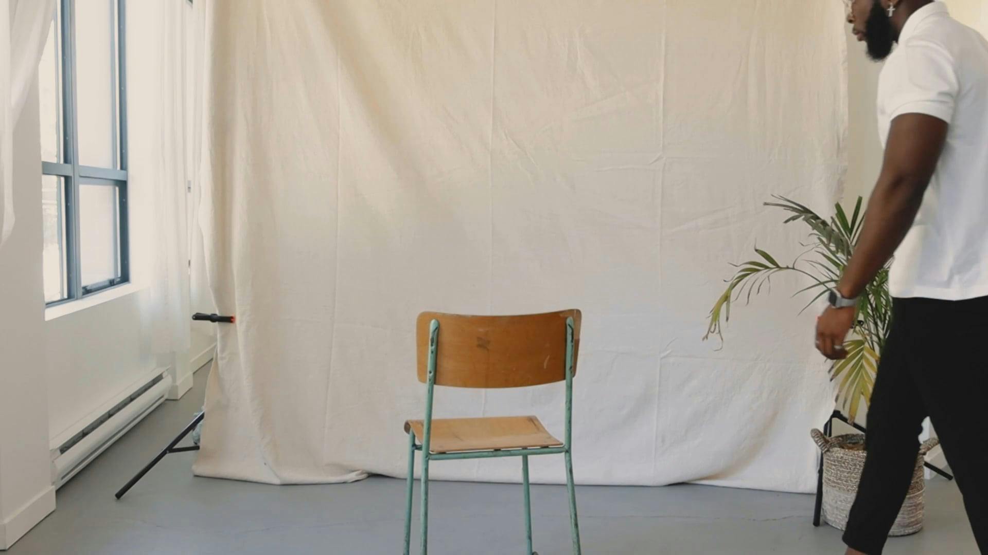 A Man Sitting Down and Posing on a Chair · Free Stock Video