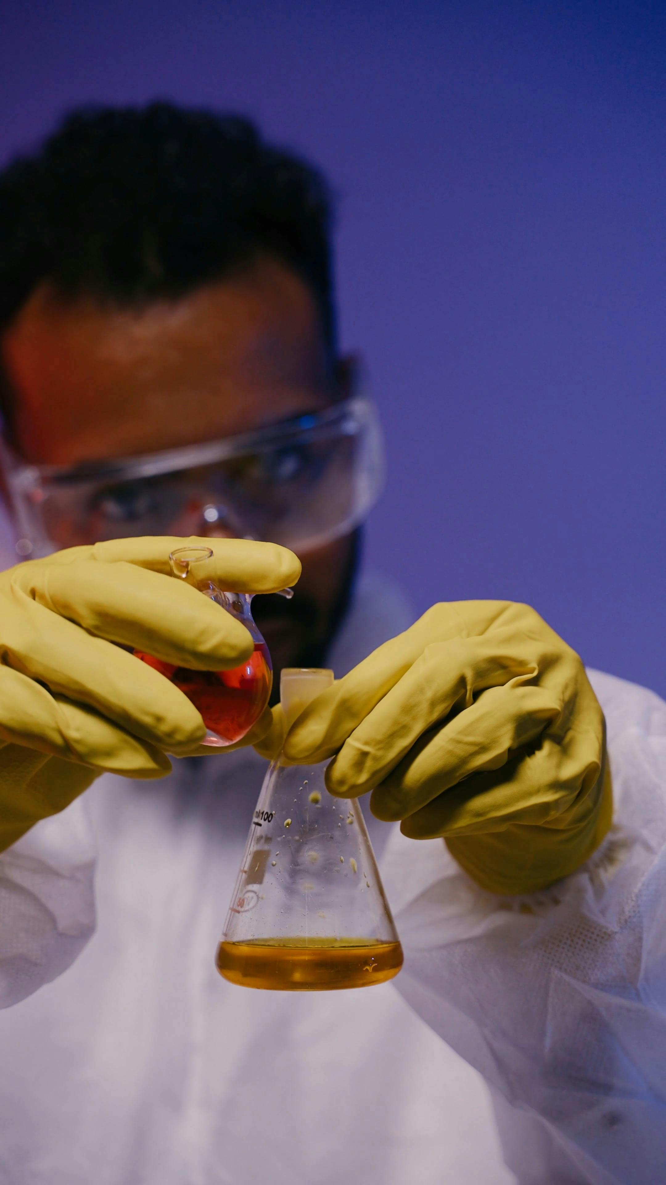 Person Pouring Liquids From the Erlenmeyer Flask Free Stock Video ...