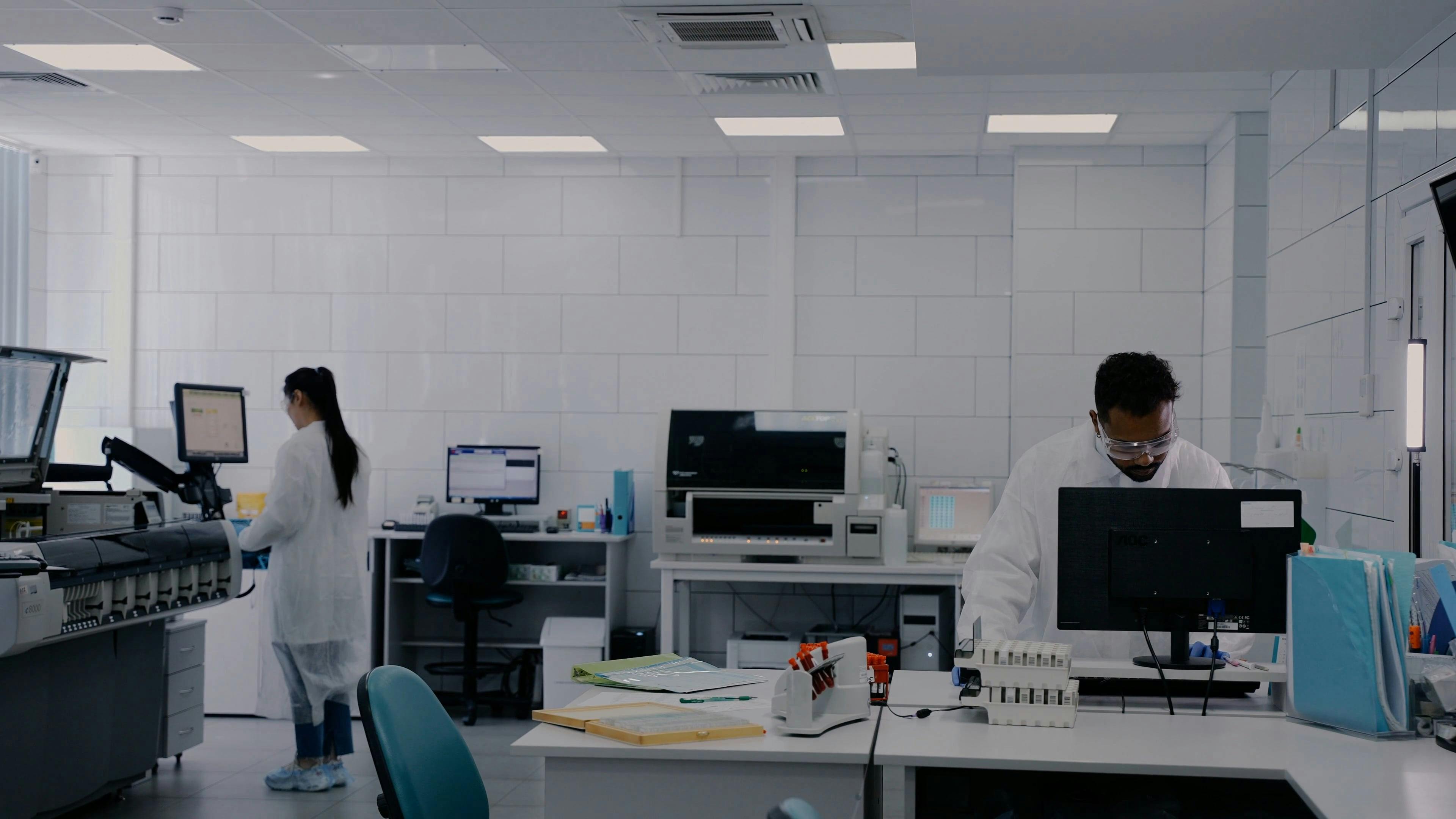 A Man Sitting while in the Laboratory · Free Stock Video