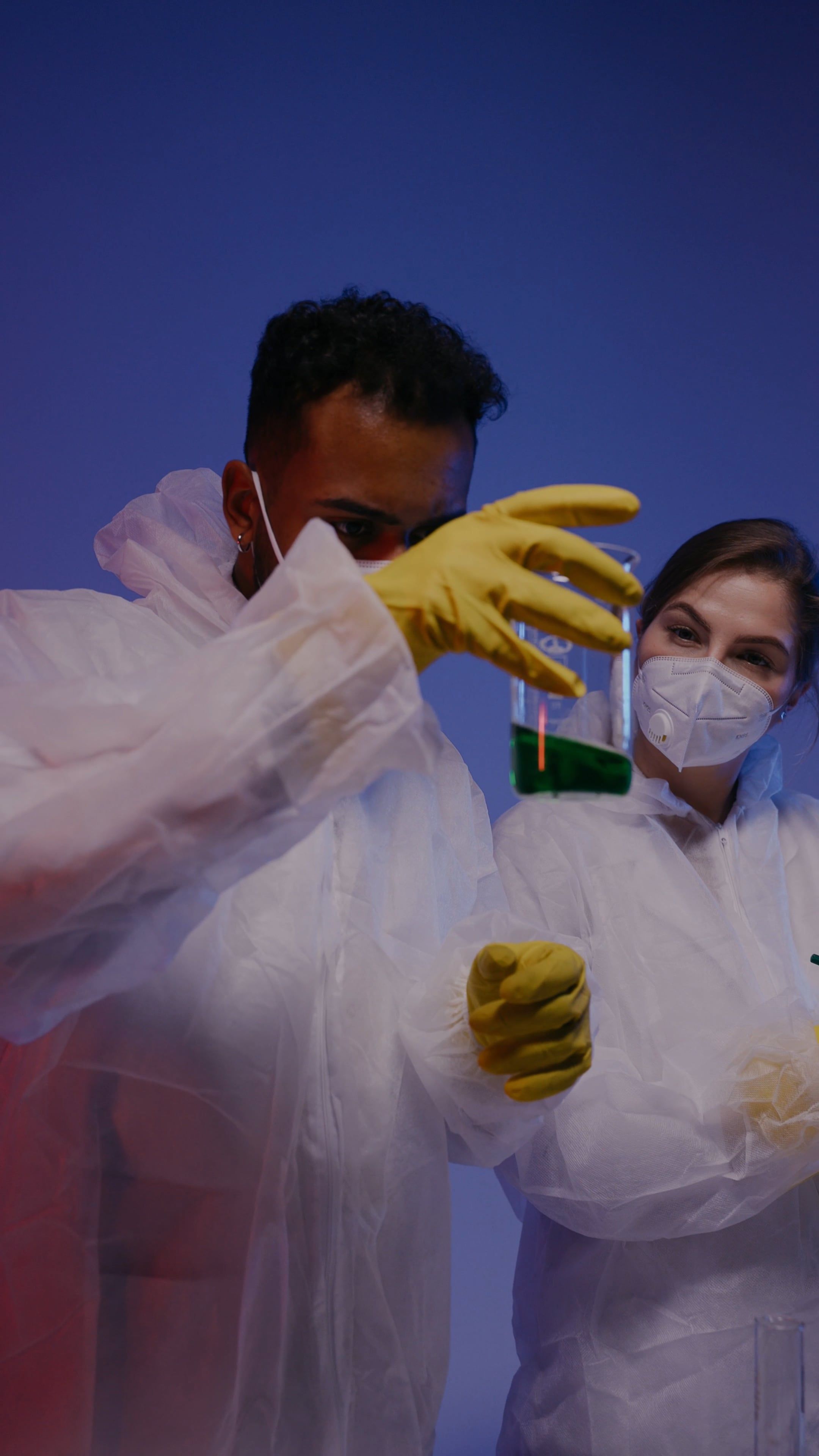 Scientists Looking at the Chemical on a Measuring Cup Free Stock Video ...