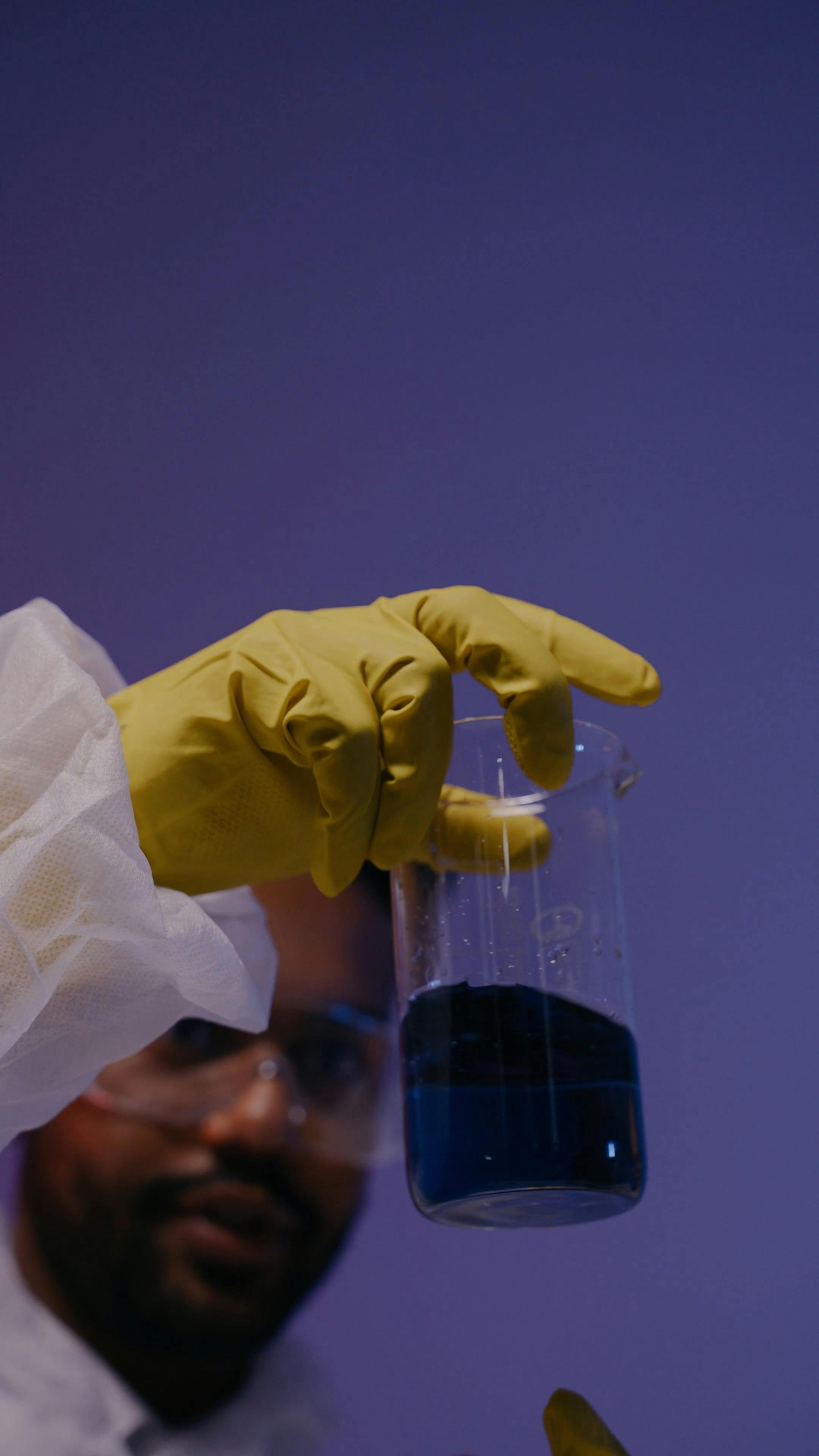 A Man Looking at the Chemical in a Beaker Free Stock Video Footage ...