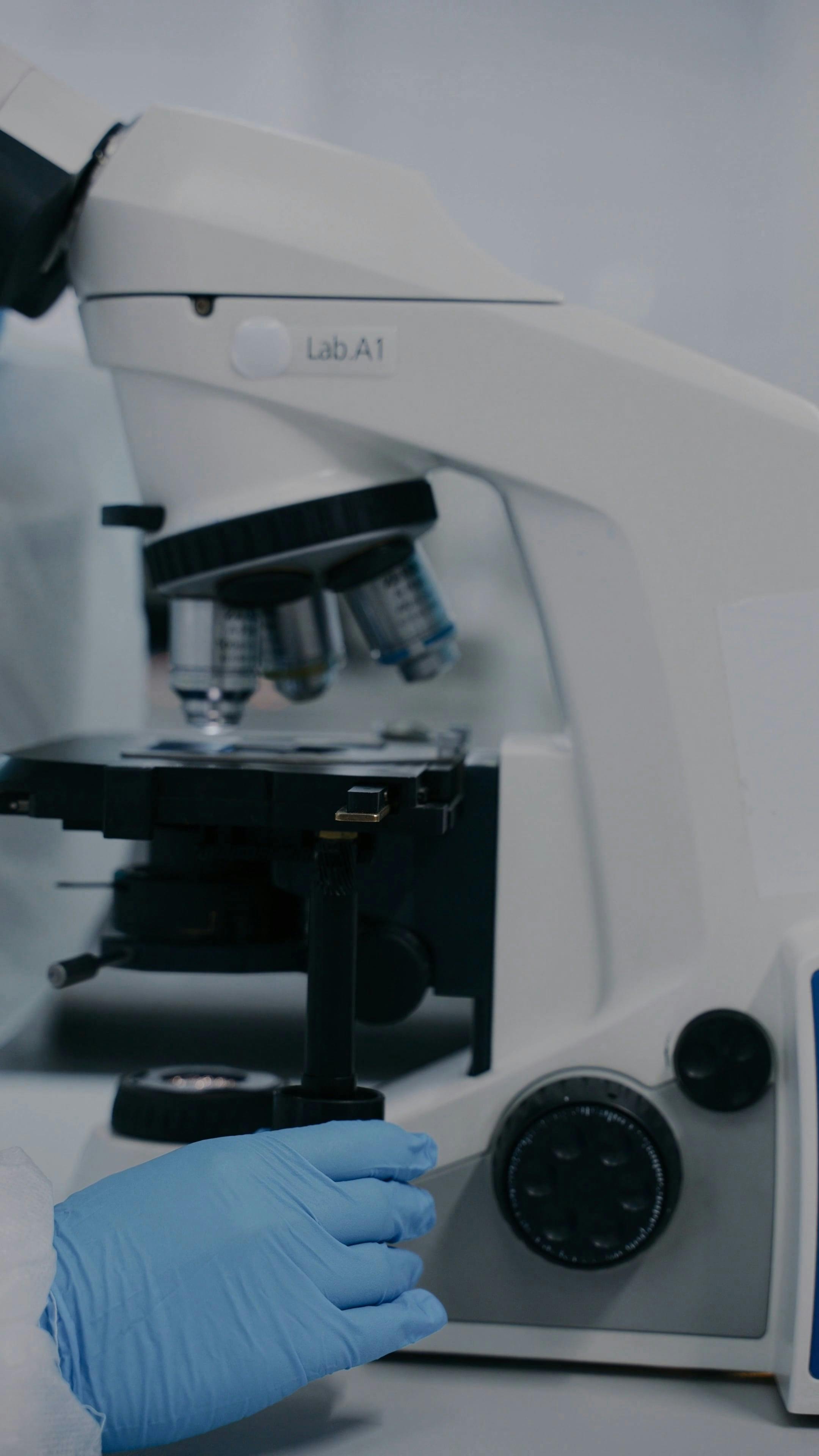 Side View of a Person Using a Microscope in a Lab Free Stock Video ...