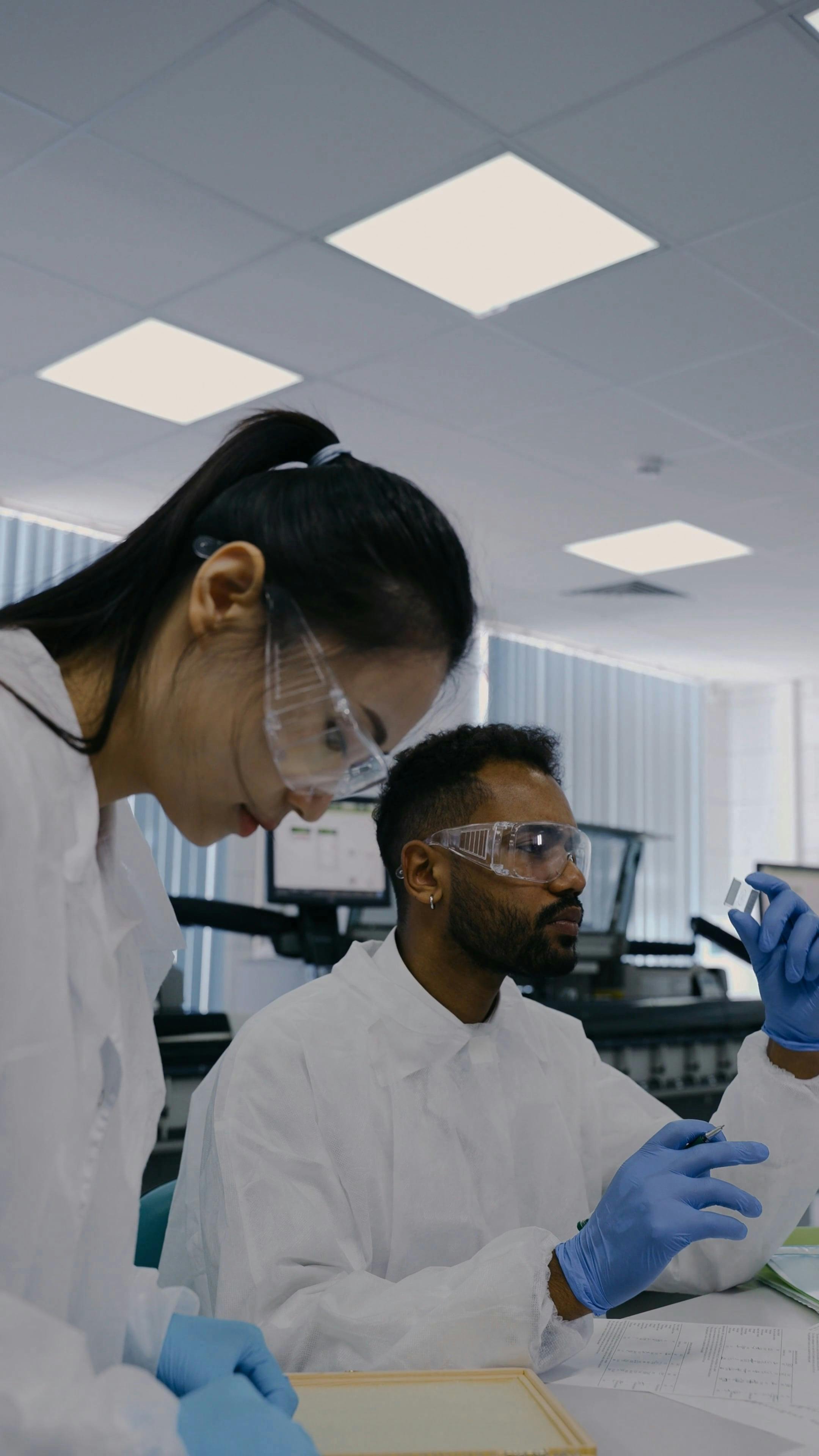 Medical Practitioners Looking at the Sample Specimen while in the ...
