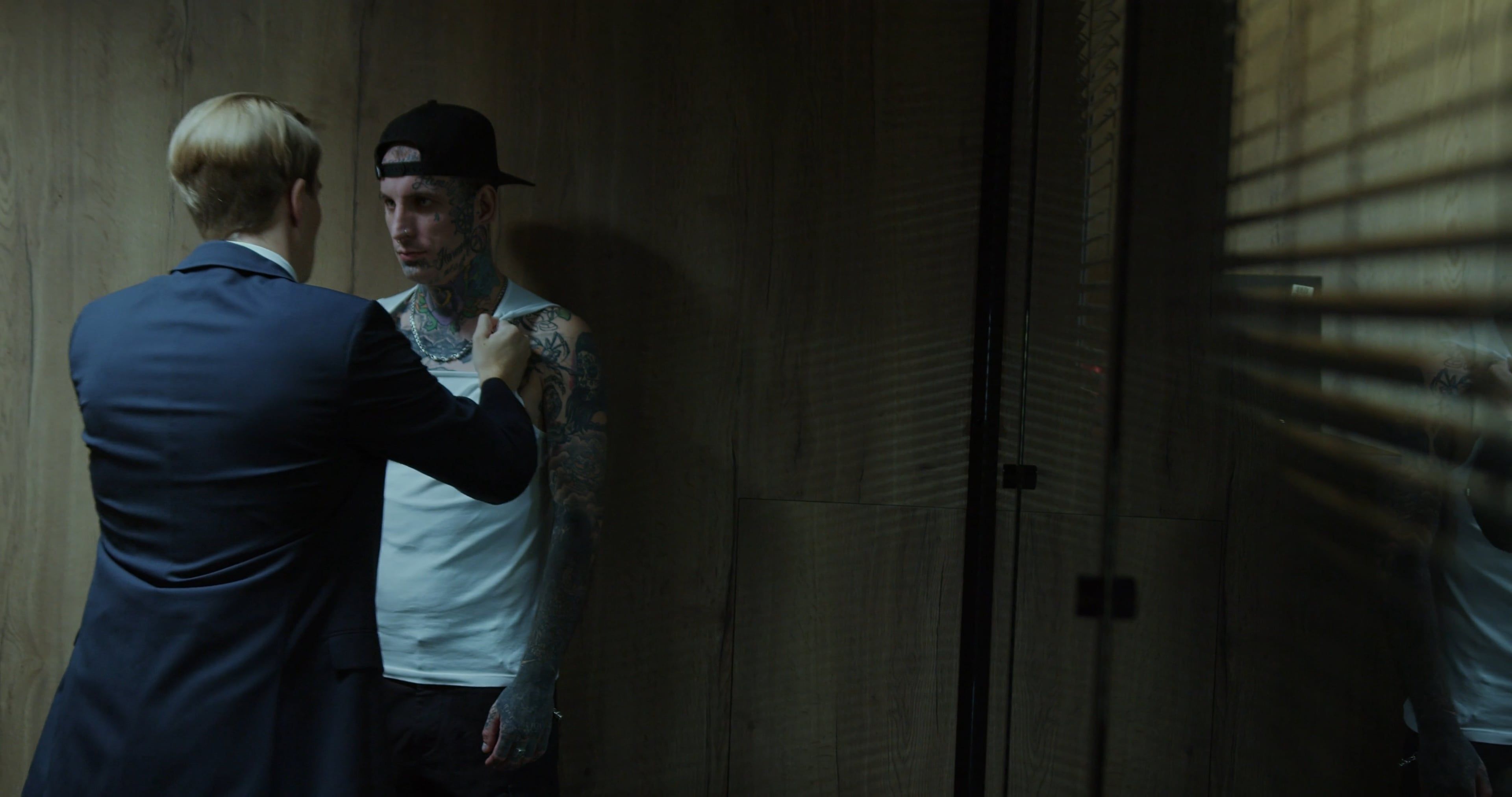 A Tattooed Man Pushed Against the Wall · Free Stock Video