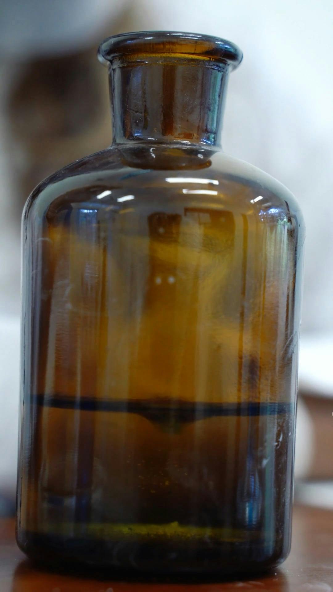 Dropping Colored Liquid in a Glass Bottle Free Stock Video Footage ...