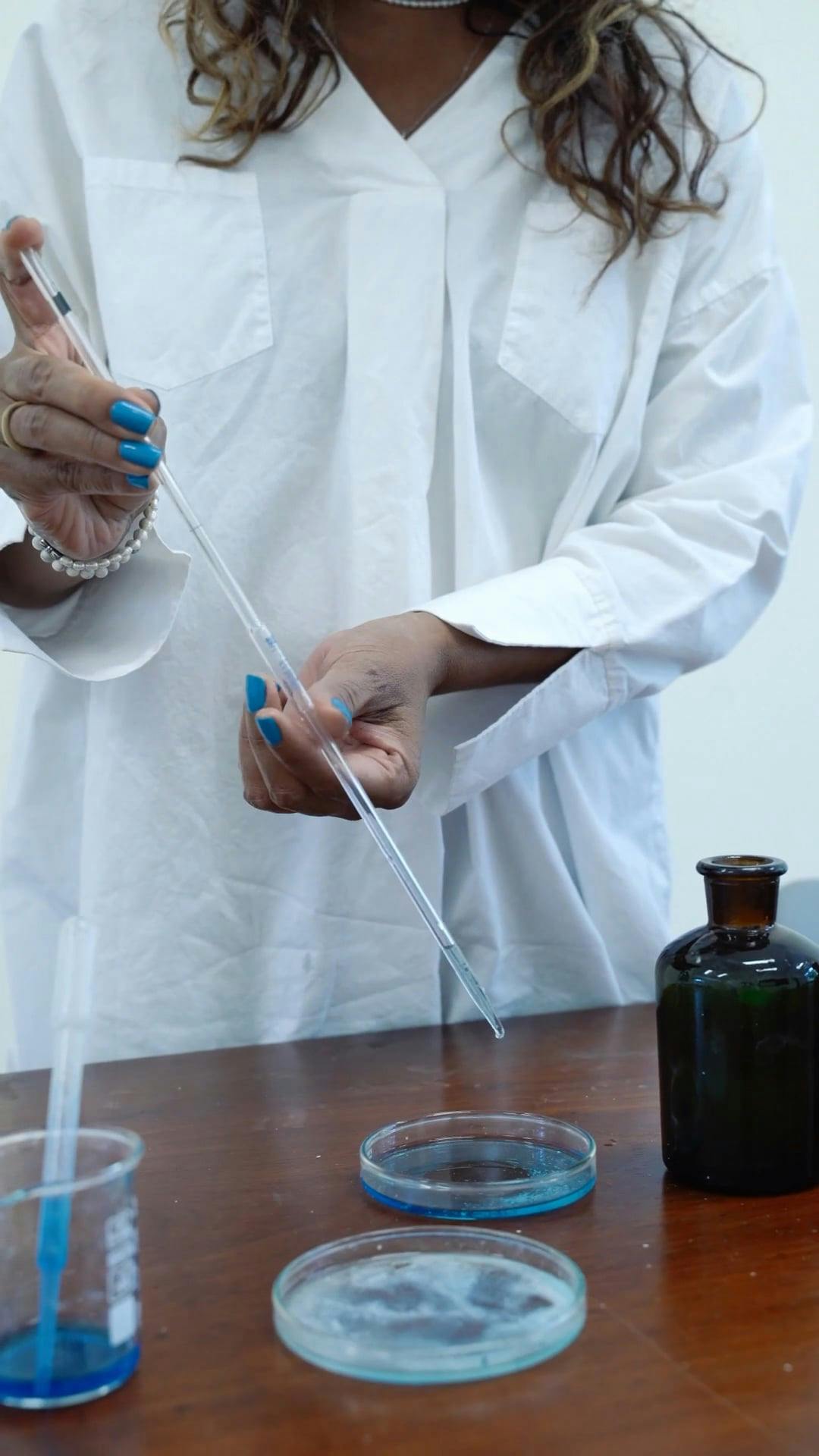 A Person Holding a Long Pipette · Free Stock Video