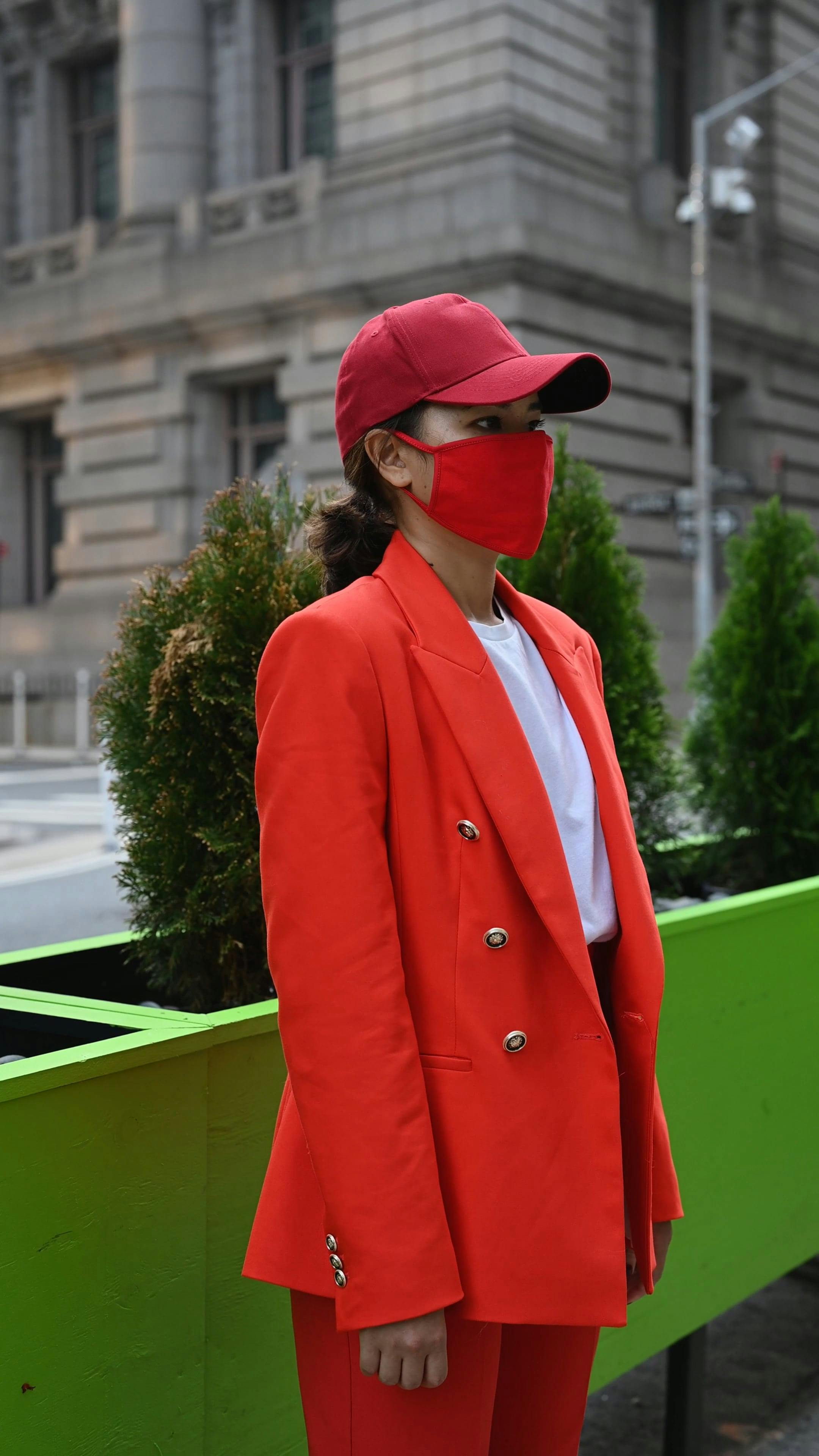 Woman Wearing Red Clothes Standing Outdoors · Free Stock Video