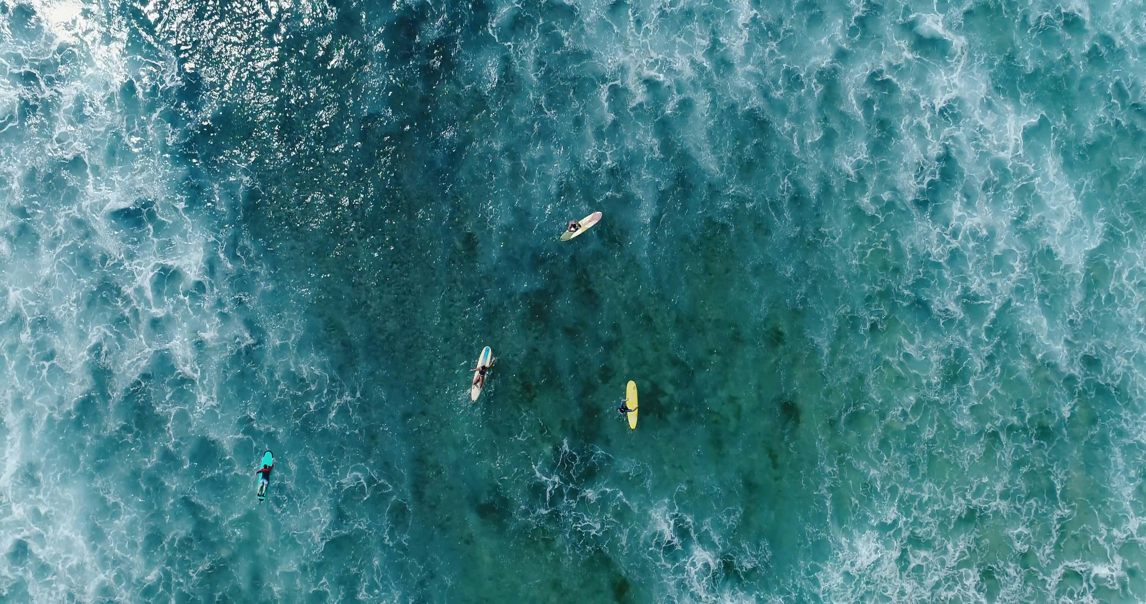Birds Eye View of an Ocean with Surfers in the Middle Free Stock Video ...