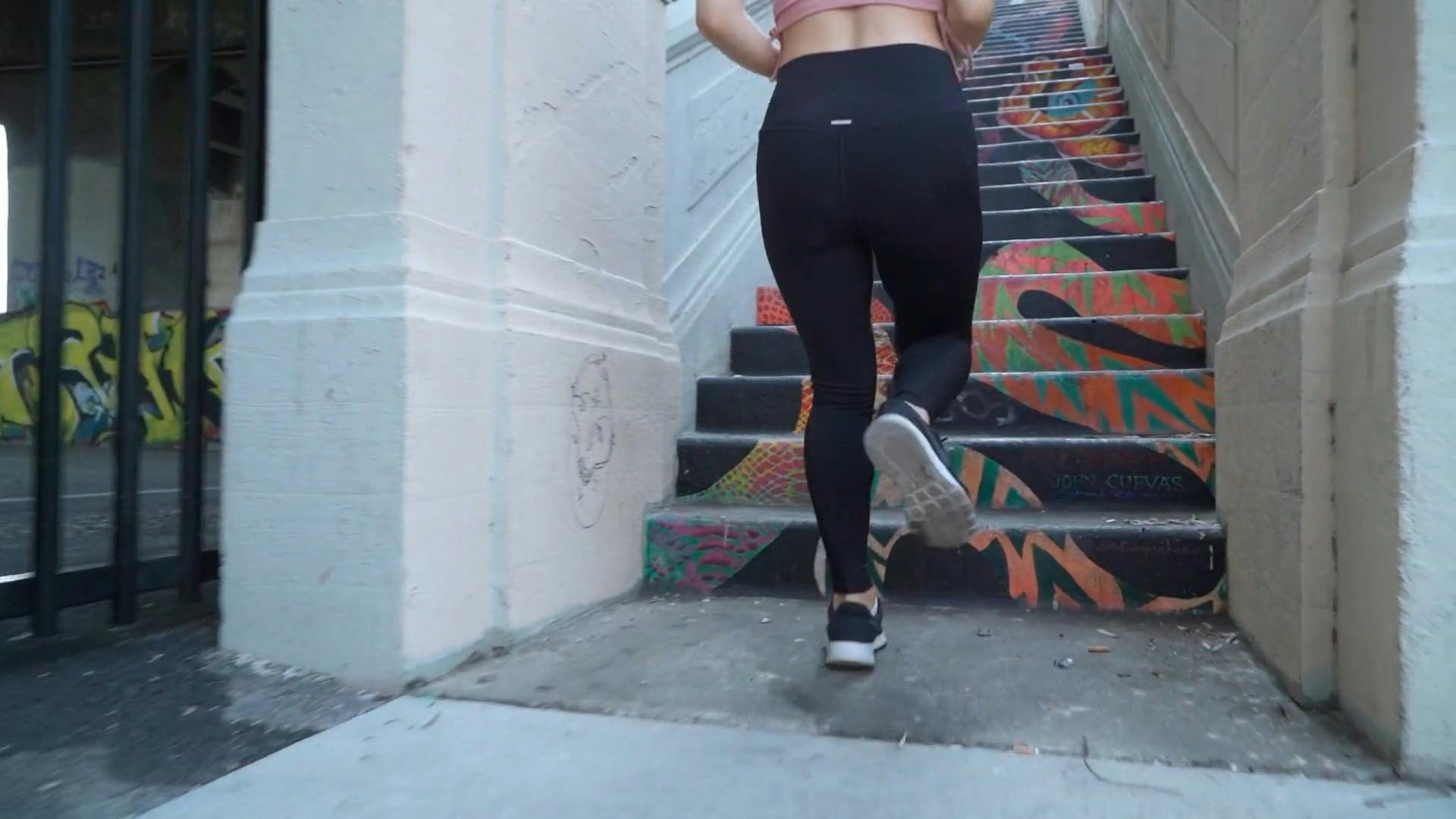 Ground Level Shot of a Woman Going up a Painted Stairway · Free Stock Video