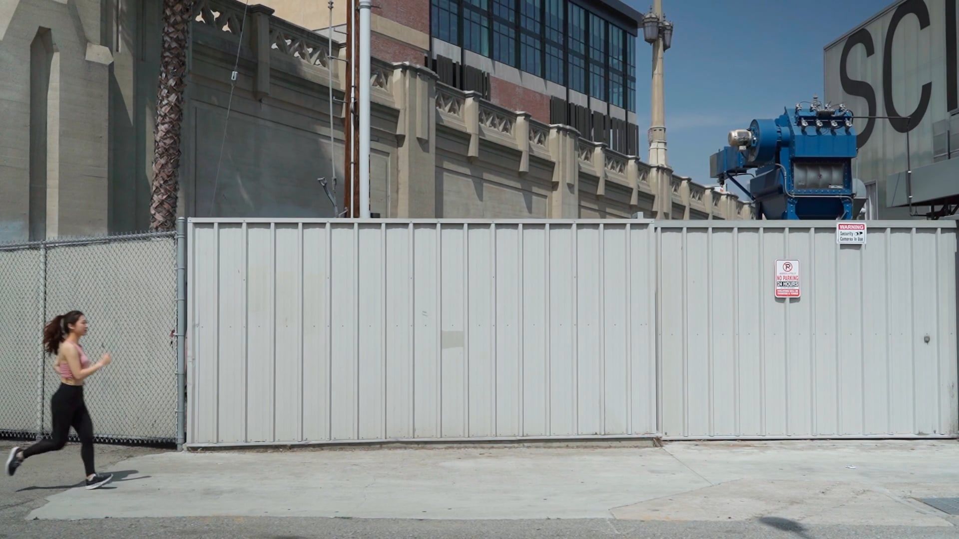 Woman Running in Front of the Building · Free Stock Video