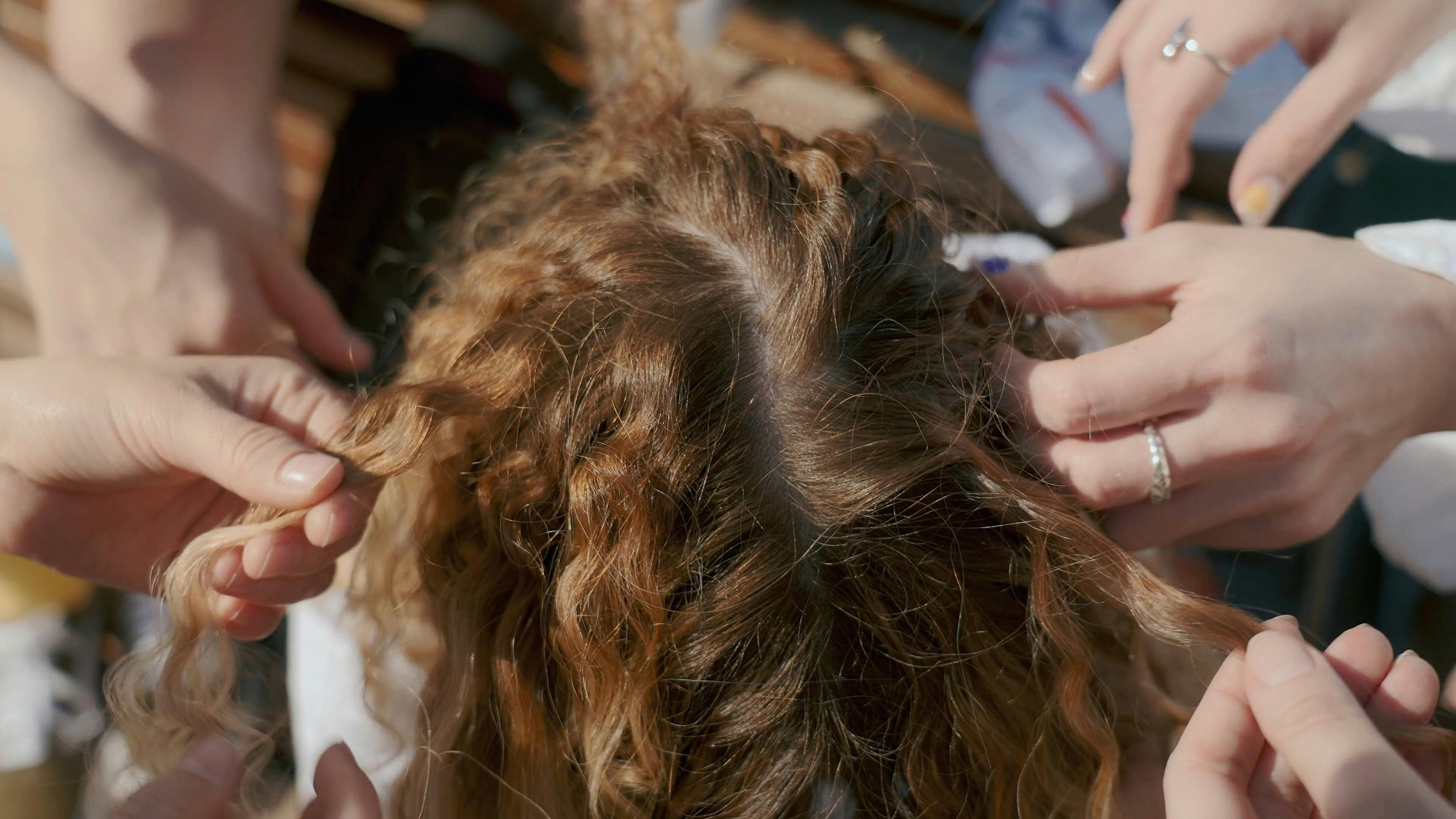 People Fixing another Person's Hair · Free Stock Video