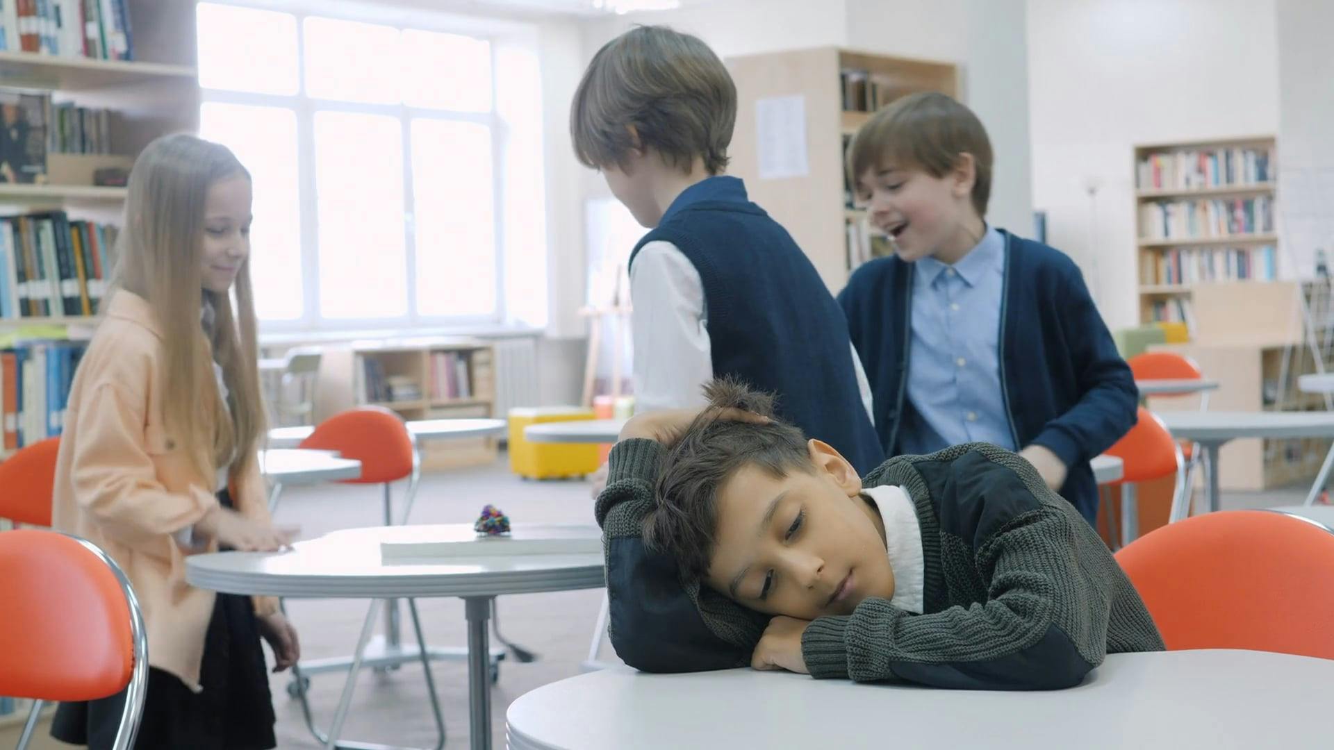 Child Sitting Alone while Other Kids Play Together Free Stock Video ...