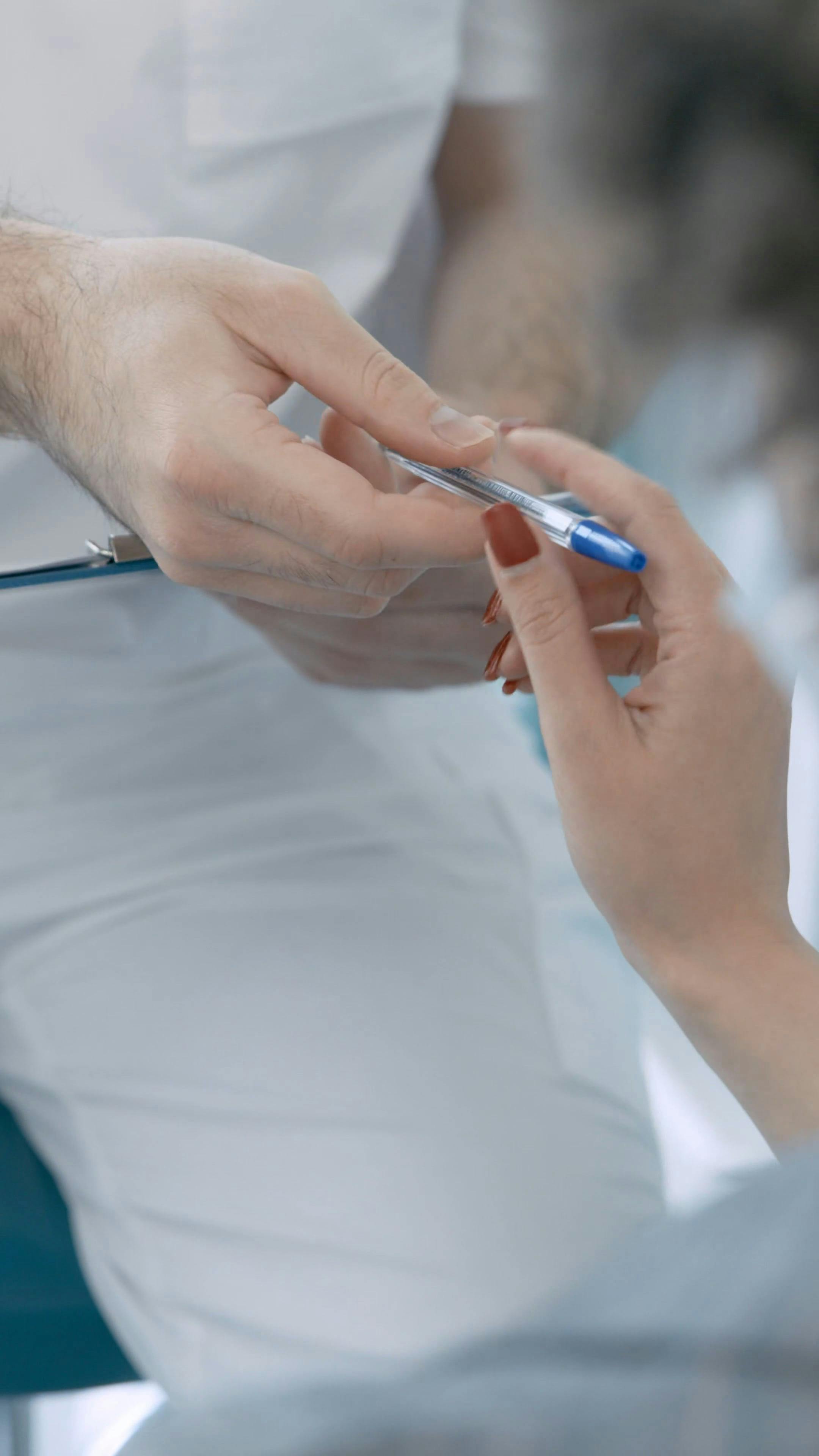 A Patient Signing a Medical Chart · Free Stock Video