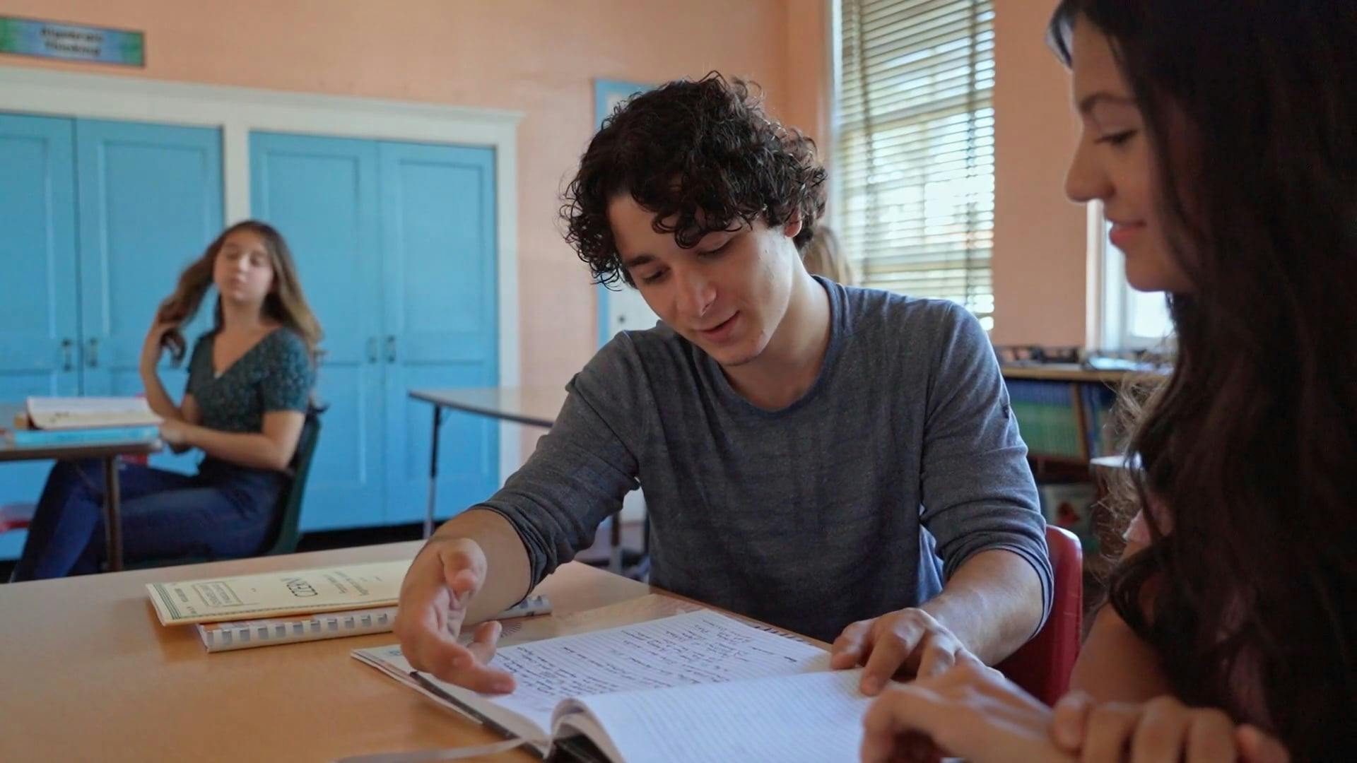 Students Reading a Notebook Together Free Stock Video Footage, Royalty ...